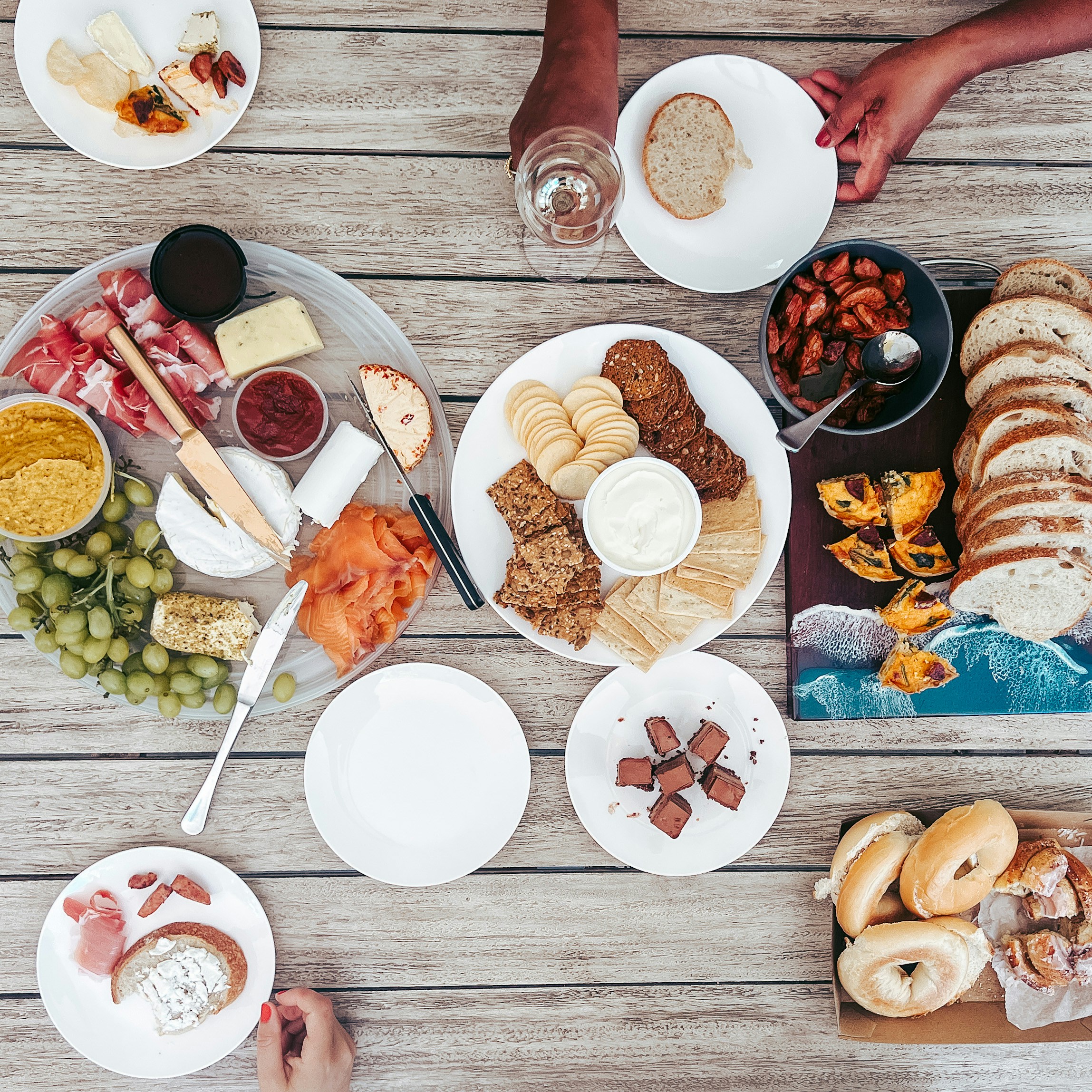 A Wooden Table Canvas of Shared Platter Delights