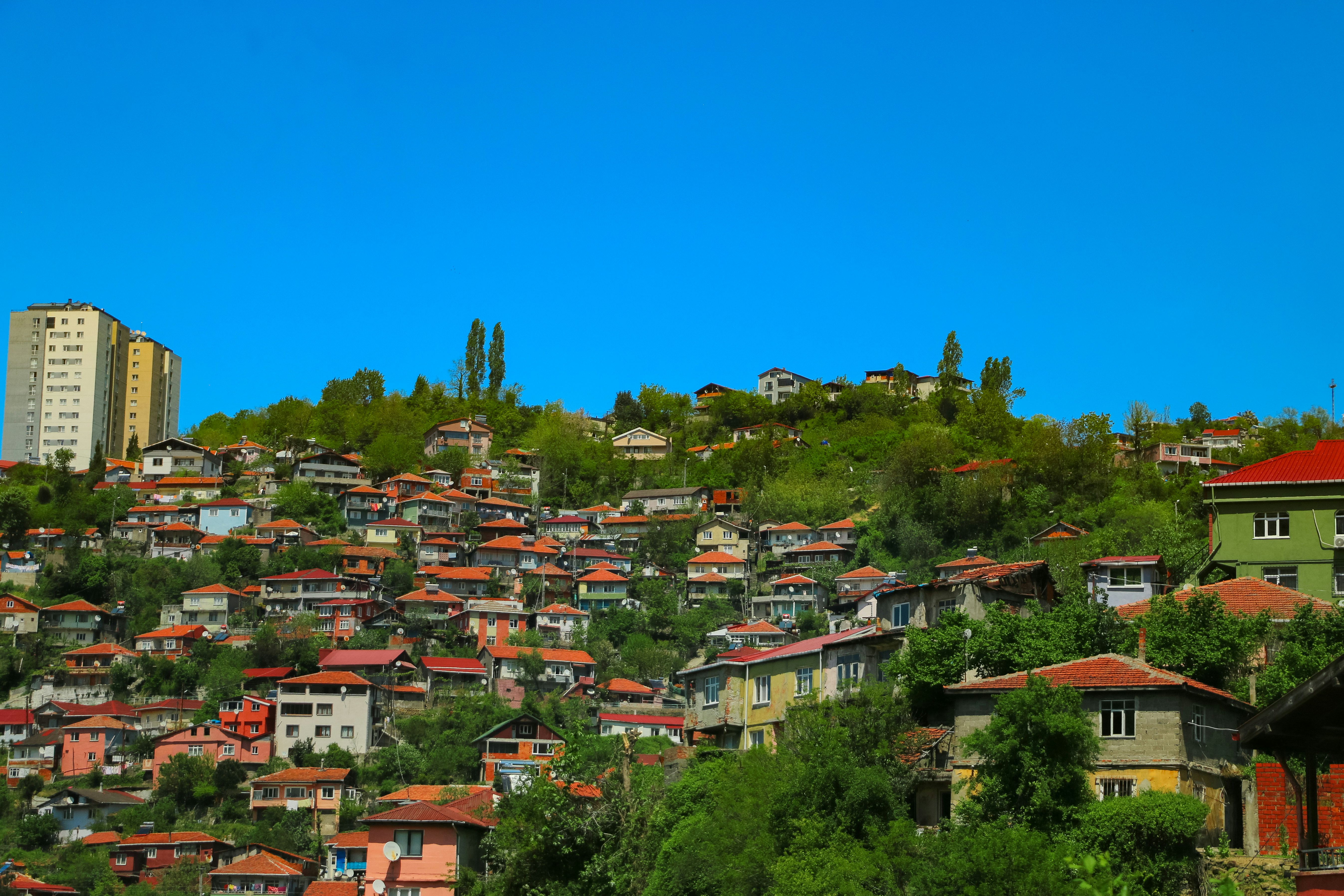 Terraced hillside village under a crystal blue sky