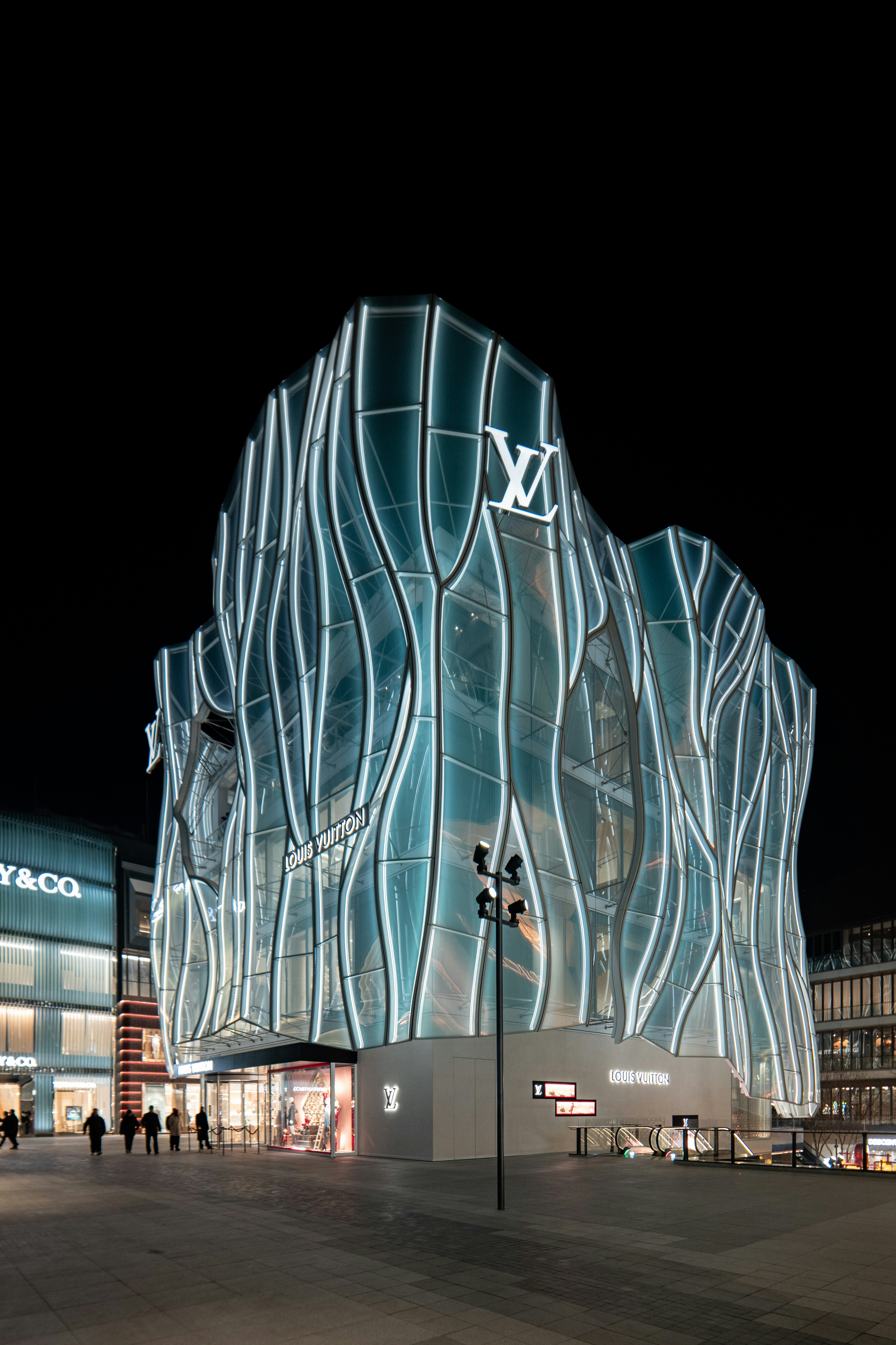 Illuminated Waveforms: The Louis Vuitton Building at Night