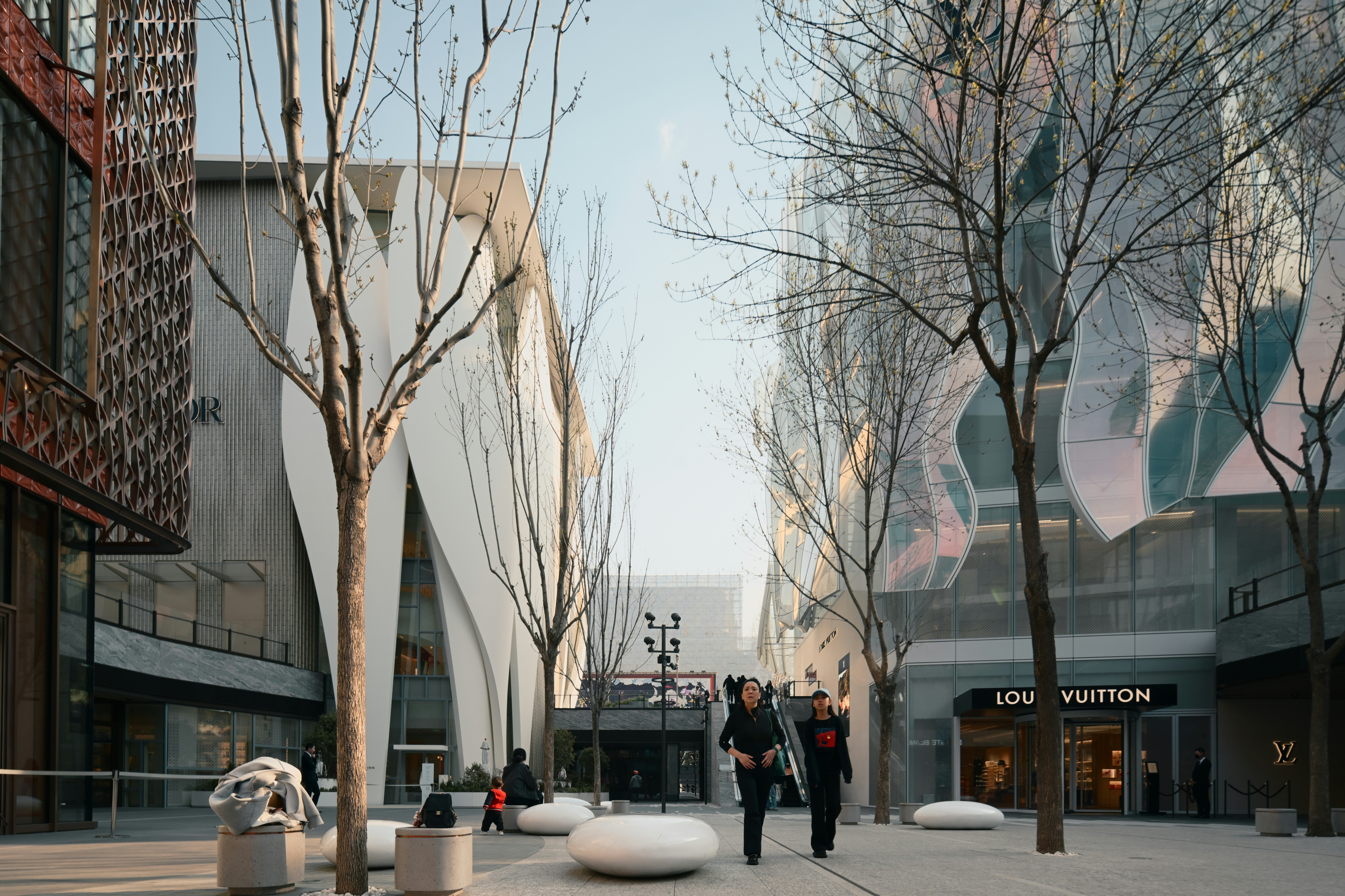 Urban Gallery: Shoppers Beneath Modern Facades
