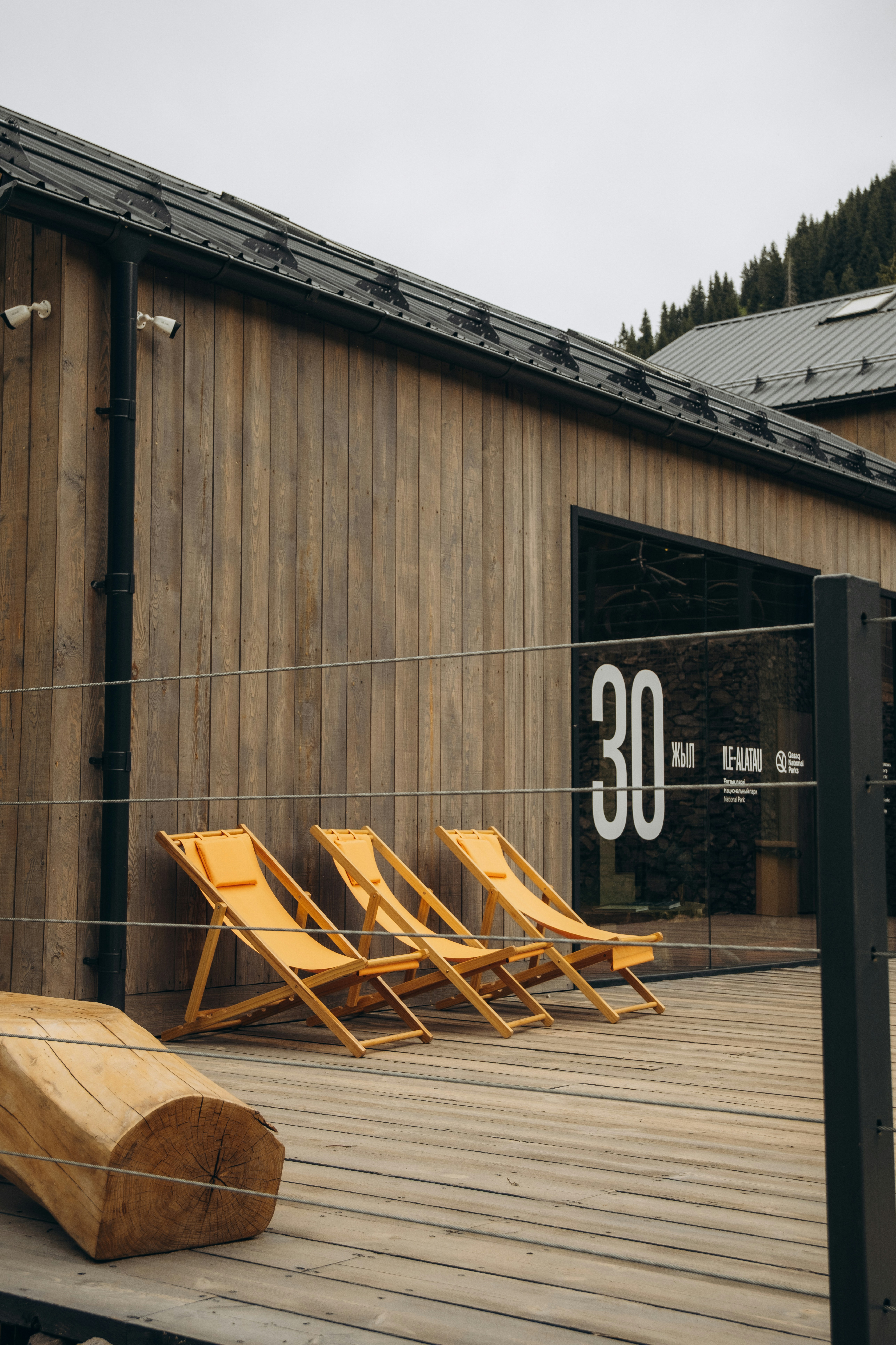 Wooden Deck Chairs by the Lodge: A Quiet Mountain Retreat