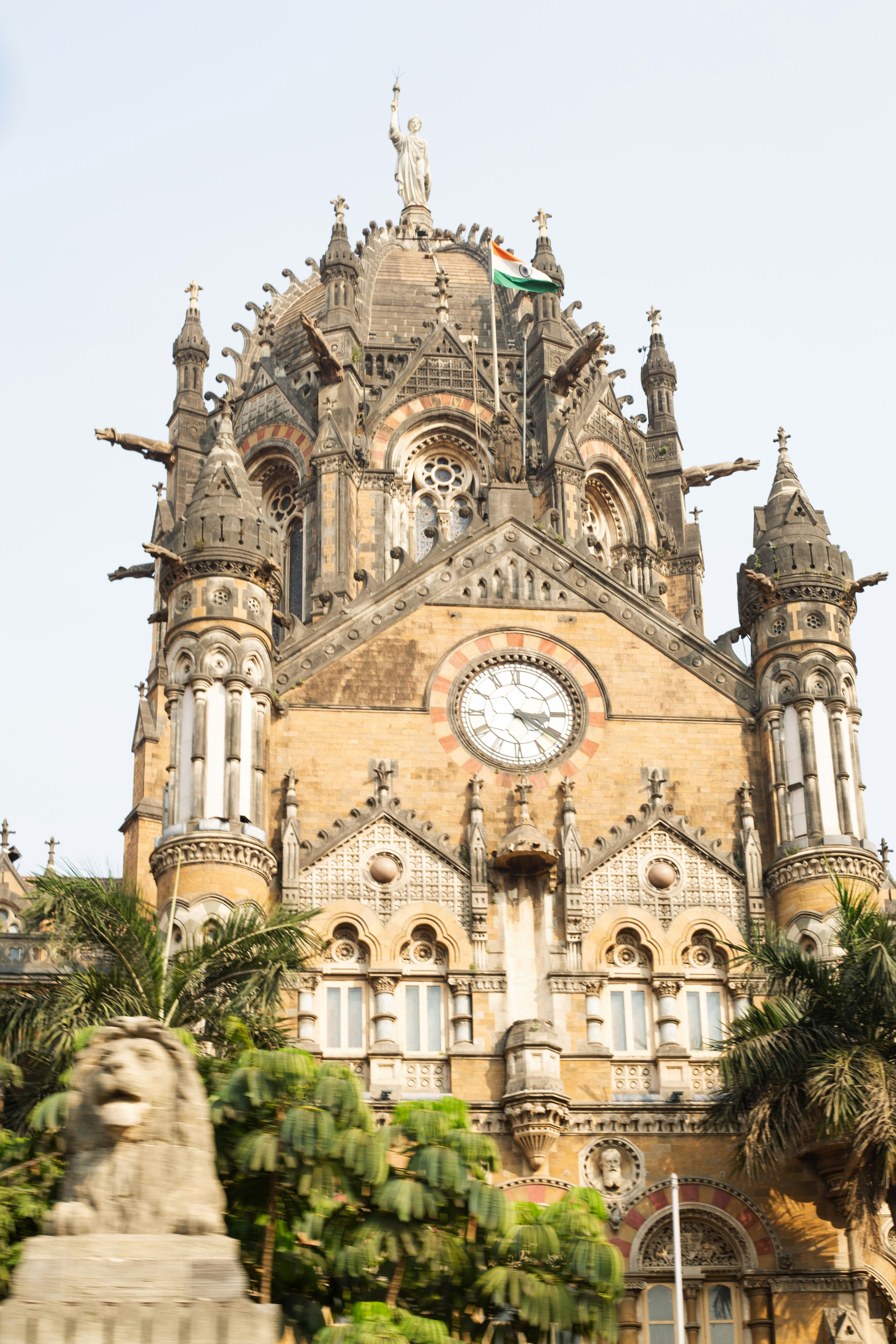 Majestic Clocktower Facade: A Historic Indian Temple in Stone