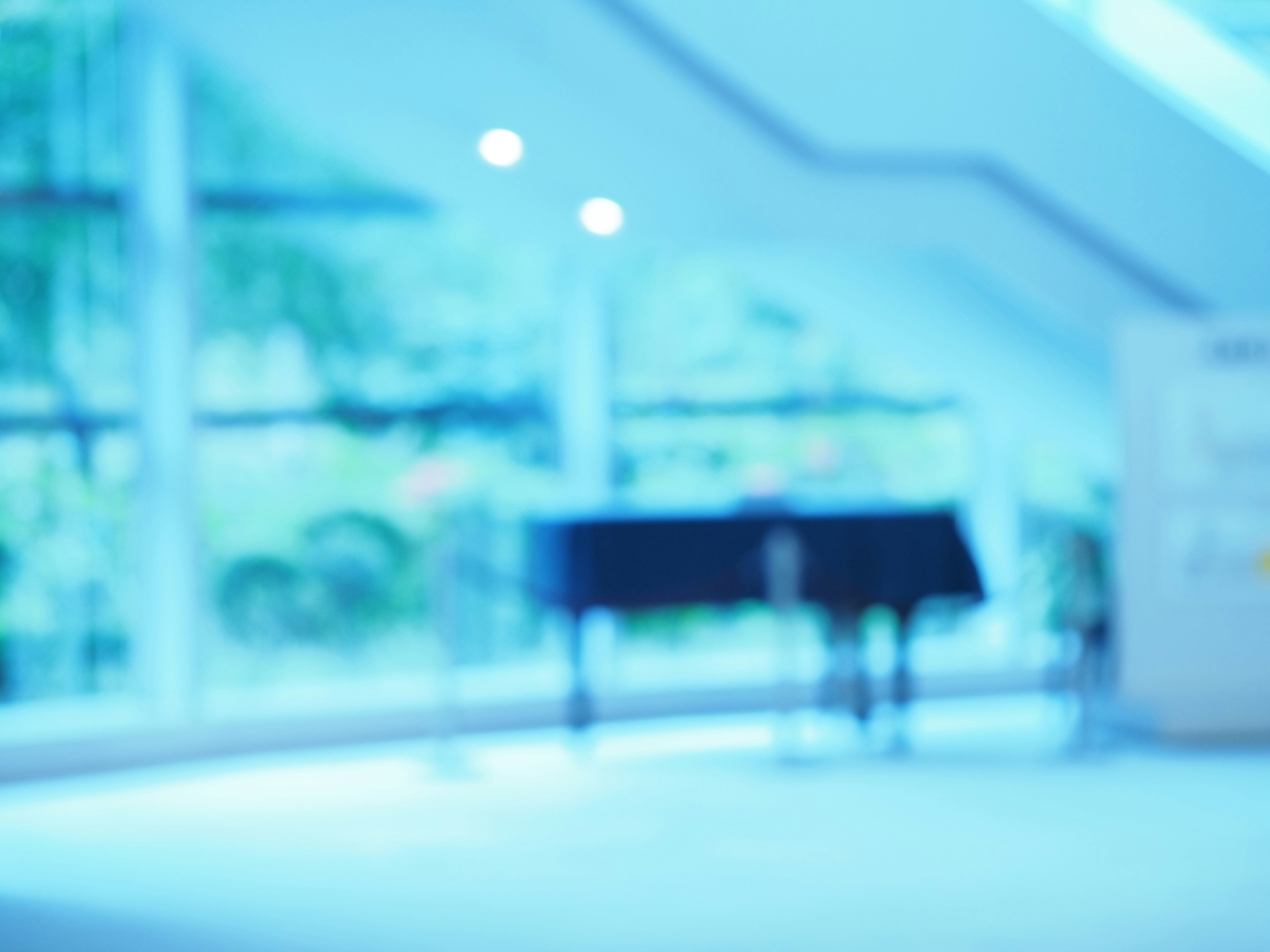 Blue-tinted Atrium Blur: An Empty Gallery of Light