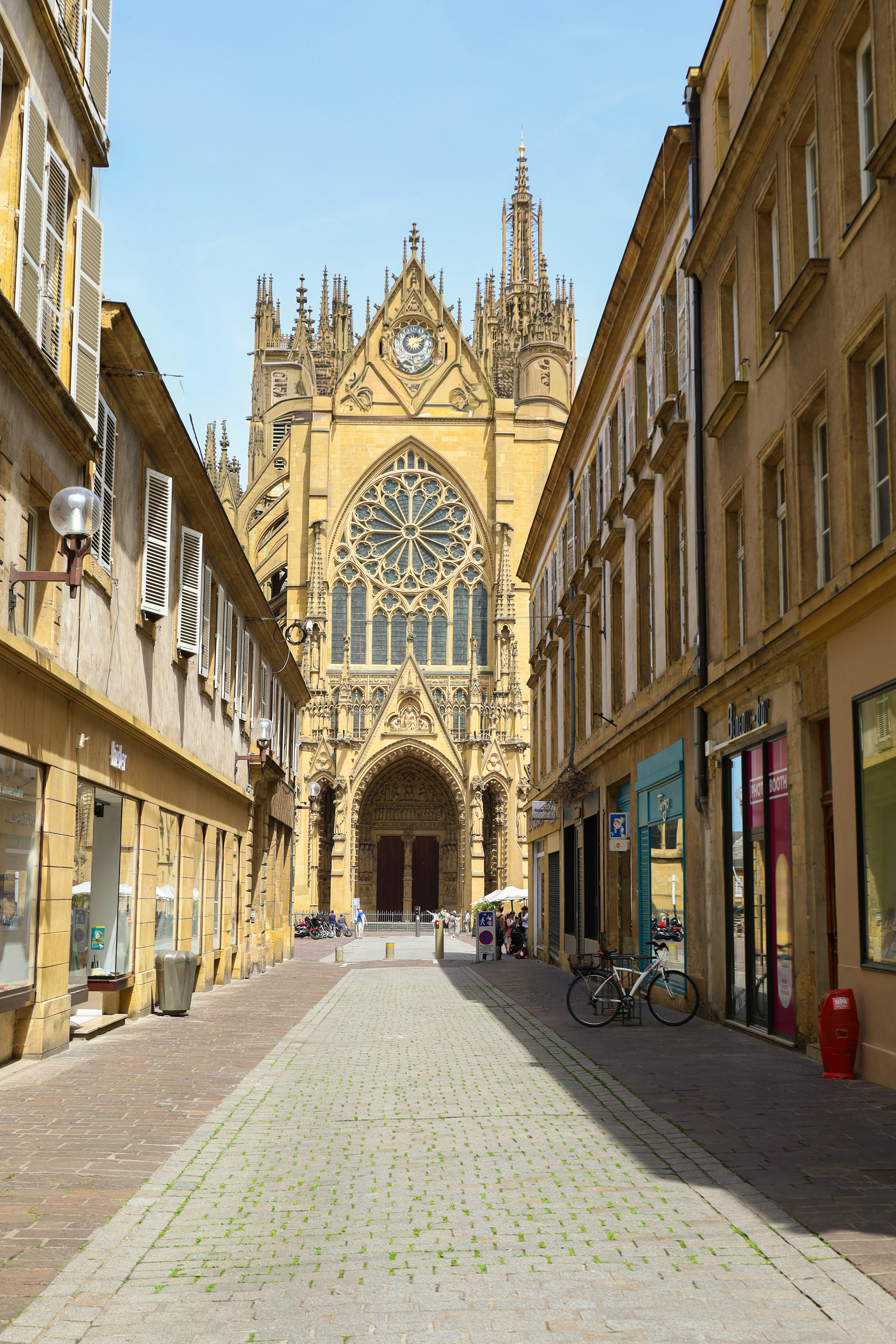 Gothic Avenue: Cathedral Doorway Framed by a Sunlit Street