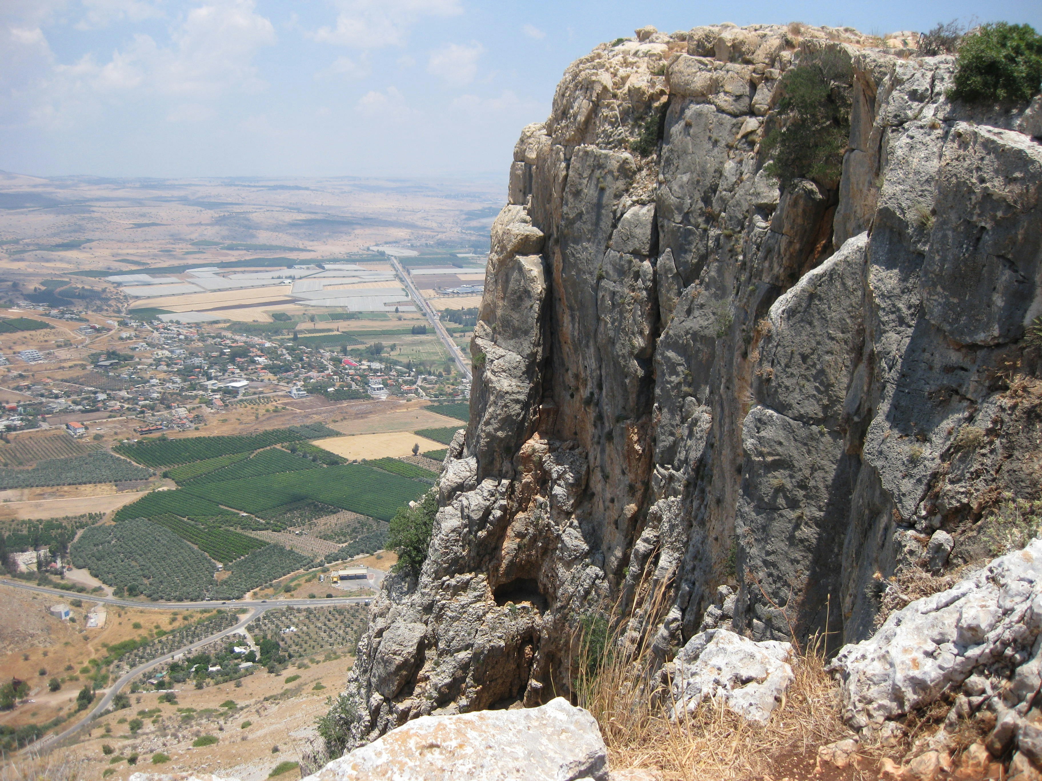 Cliff Edge Overlook: A Quiet Valley Unfolds Beneath Jagged Granite