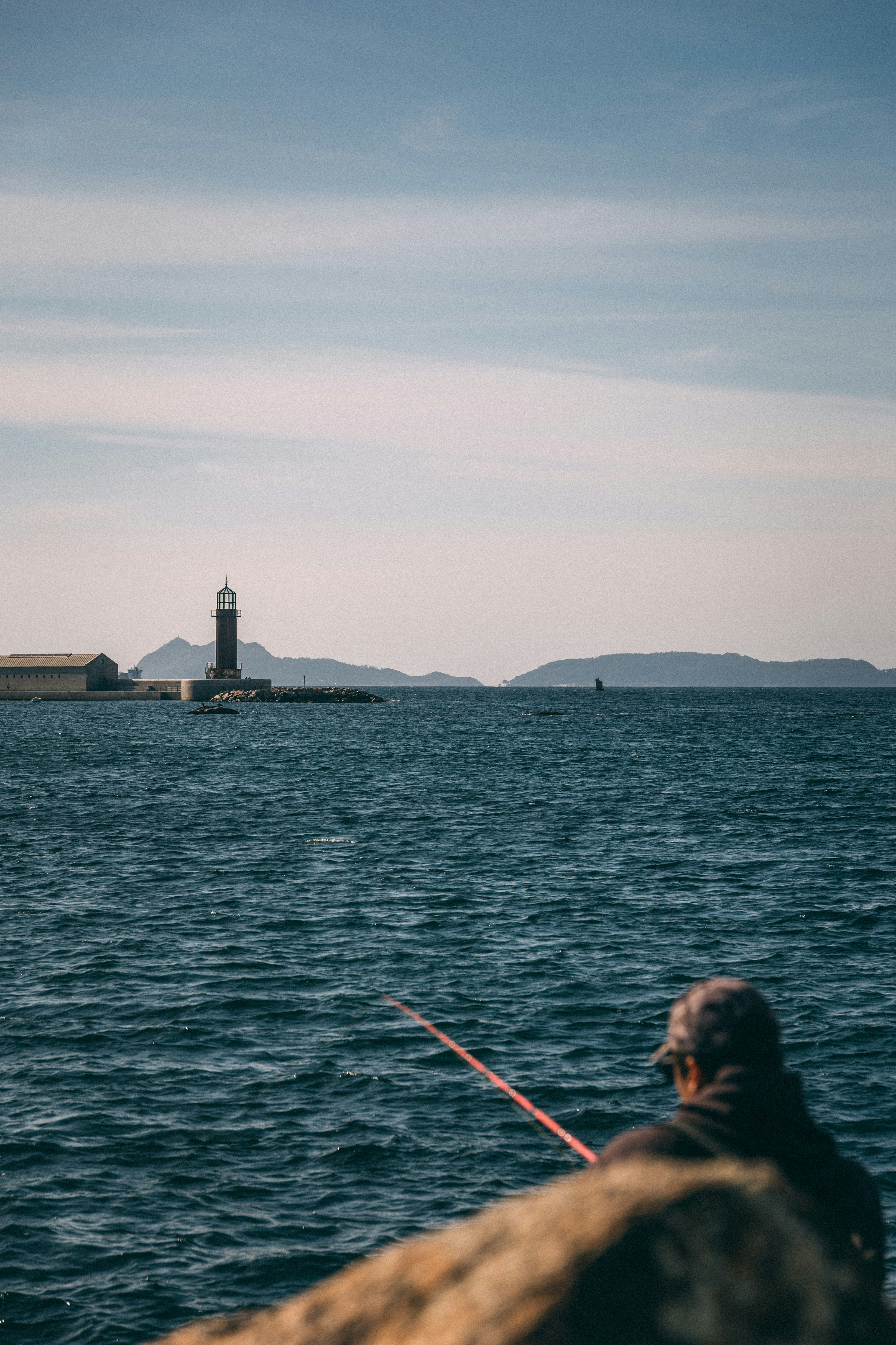 Lighthouse Watch: Quiet Coast and Casting Line
