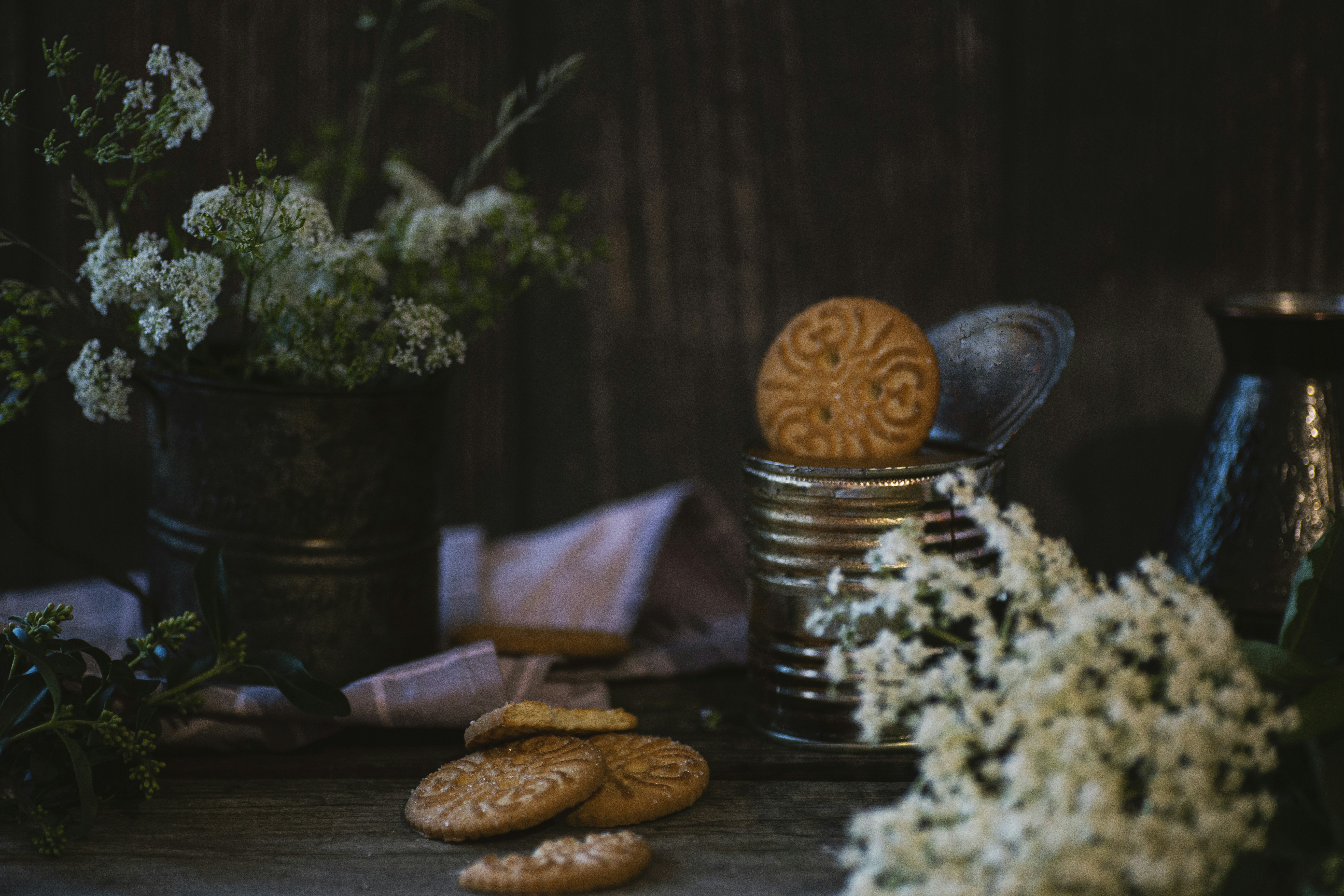 Quiet Still Life: Cookies and Florals on Wooden Table