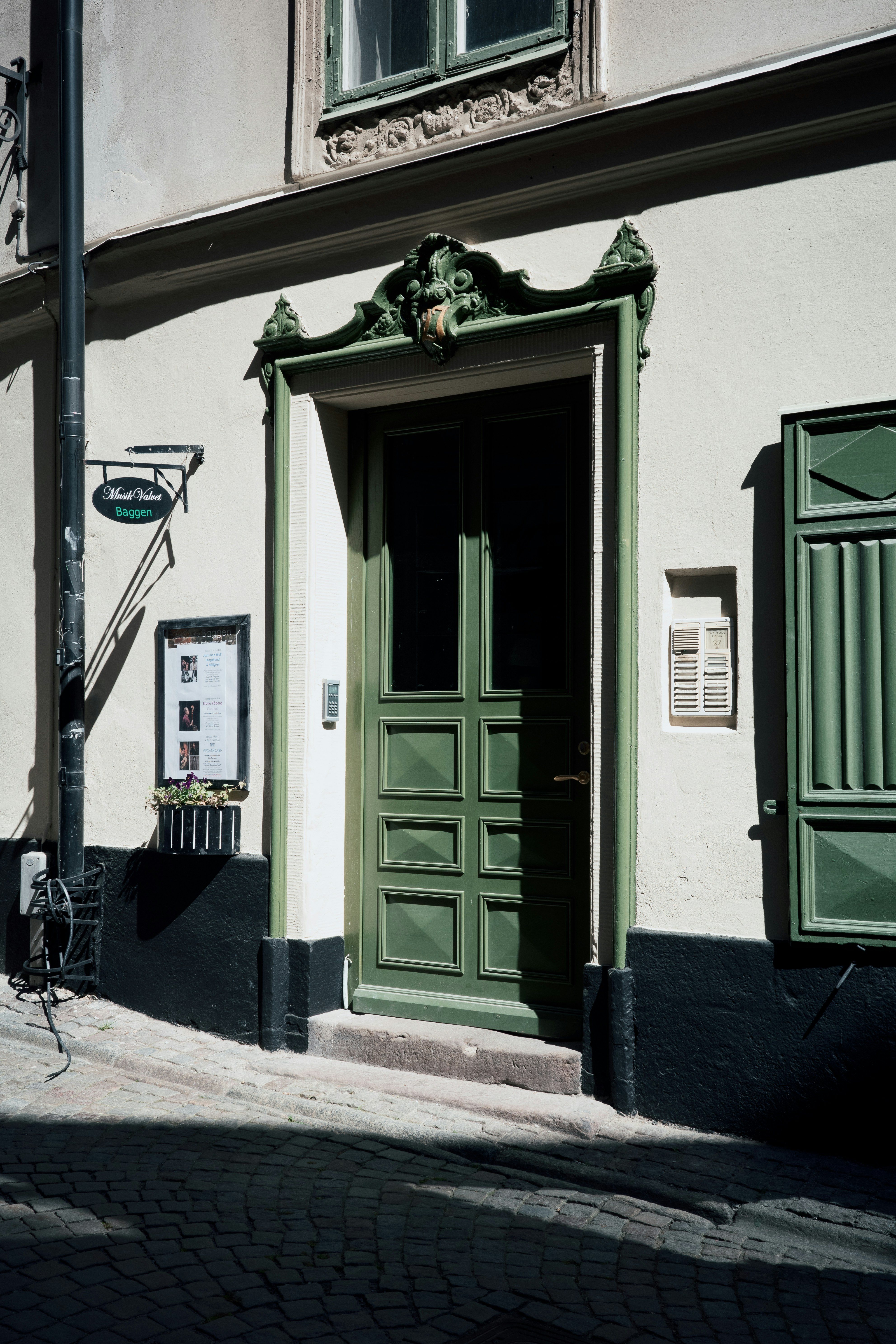 Green Doorway in Sunlit European Street