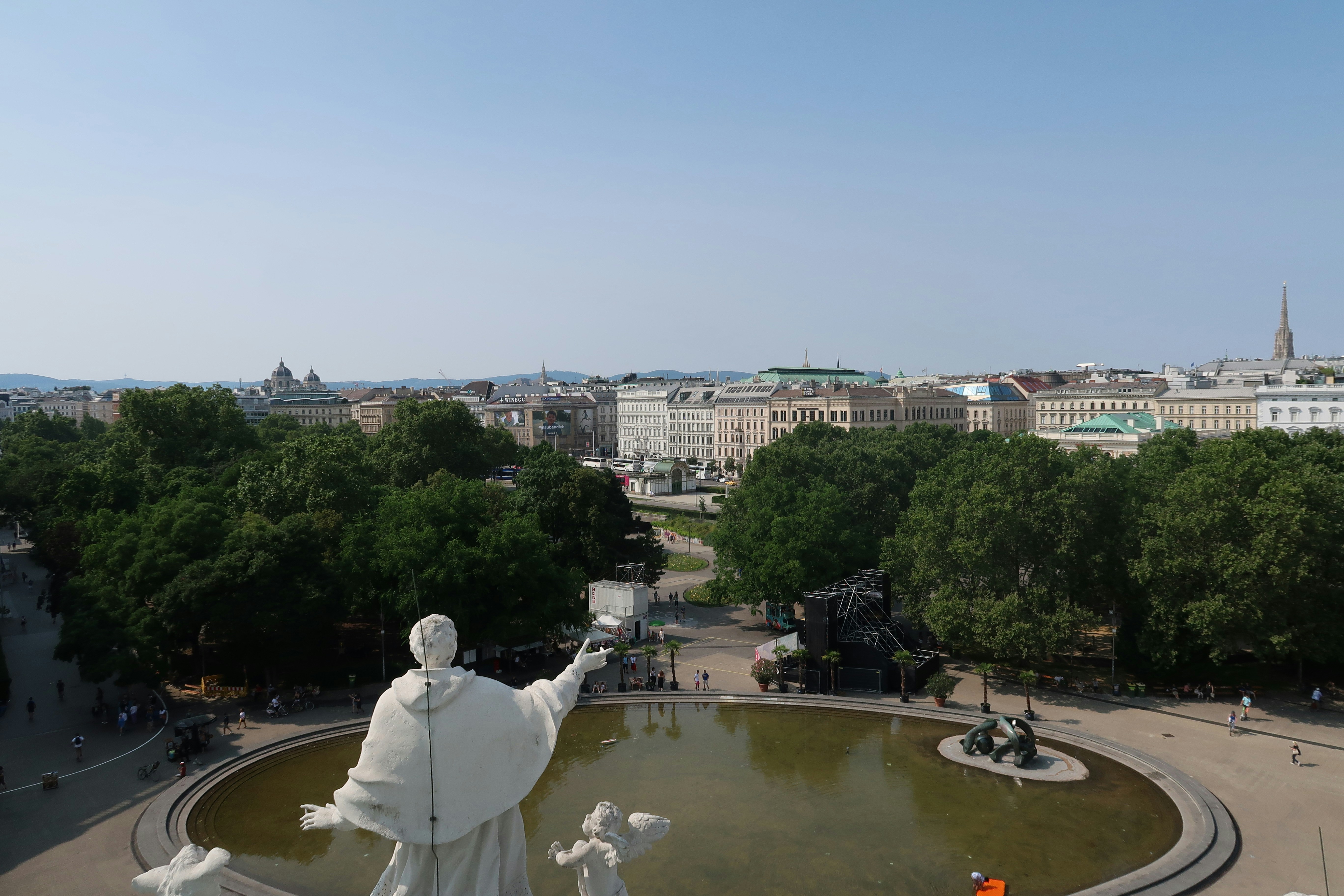 Statue Front and City Vista: A Park Panorama Overlook