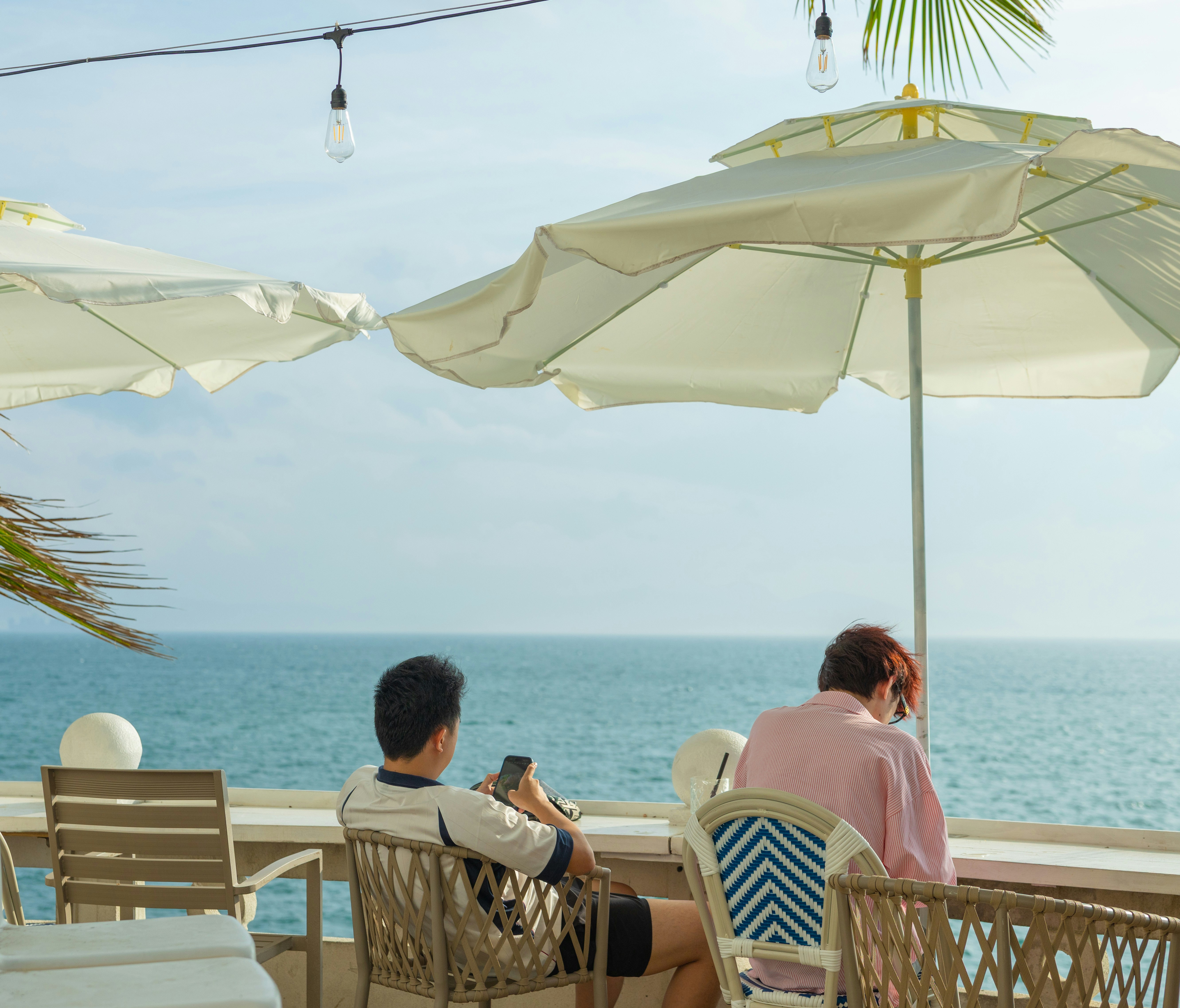 Oceanview Lounge: Sunlit Conversations Under a Beachside Umbrella