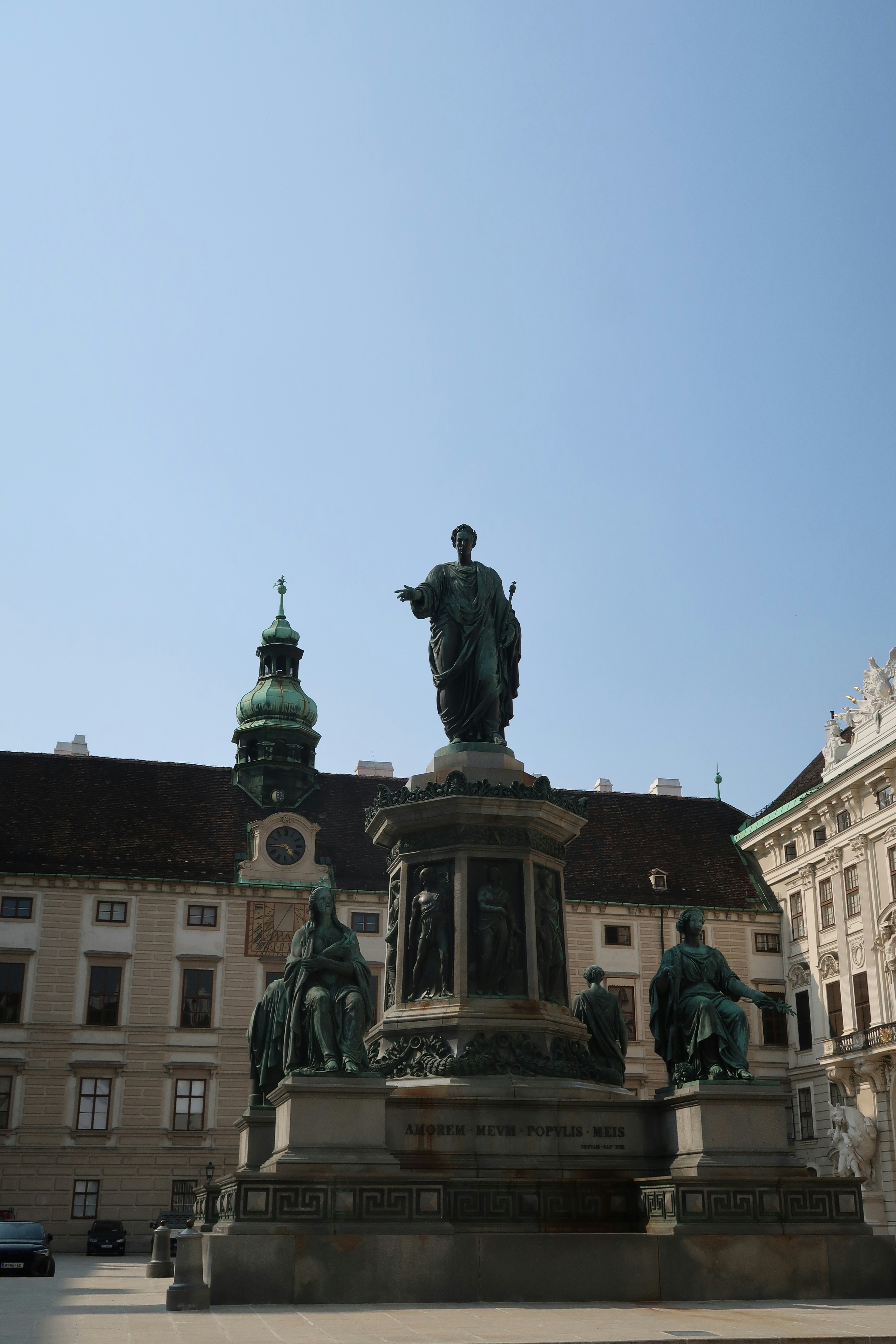 Statue and Monument in a Sunlit European Square