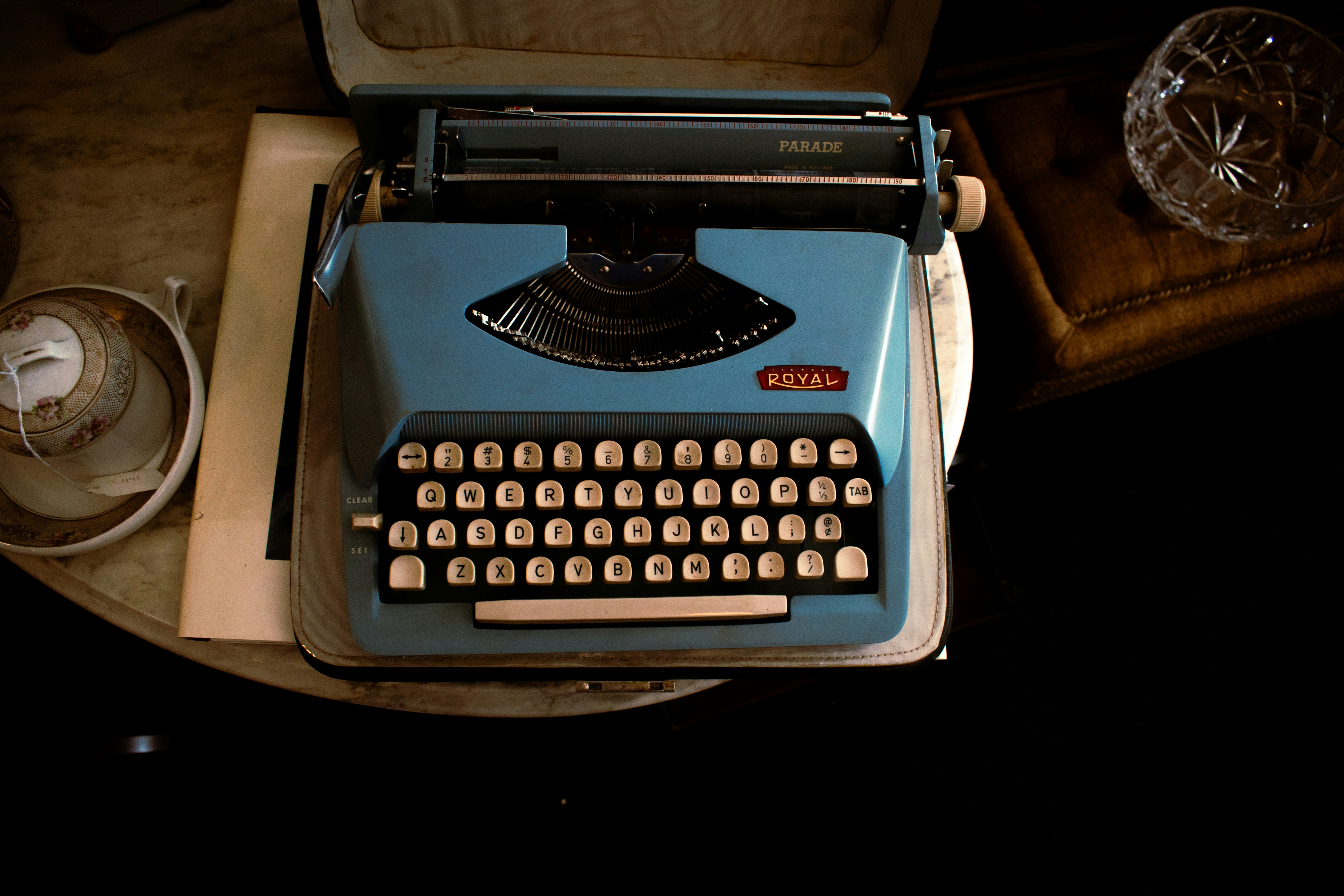 Blue Royal: a vintage typewriter resting on a wooden surface