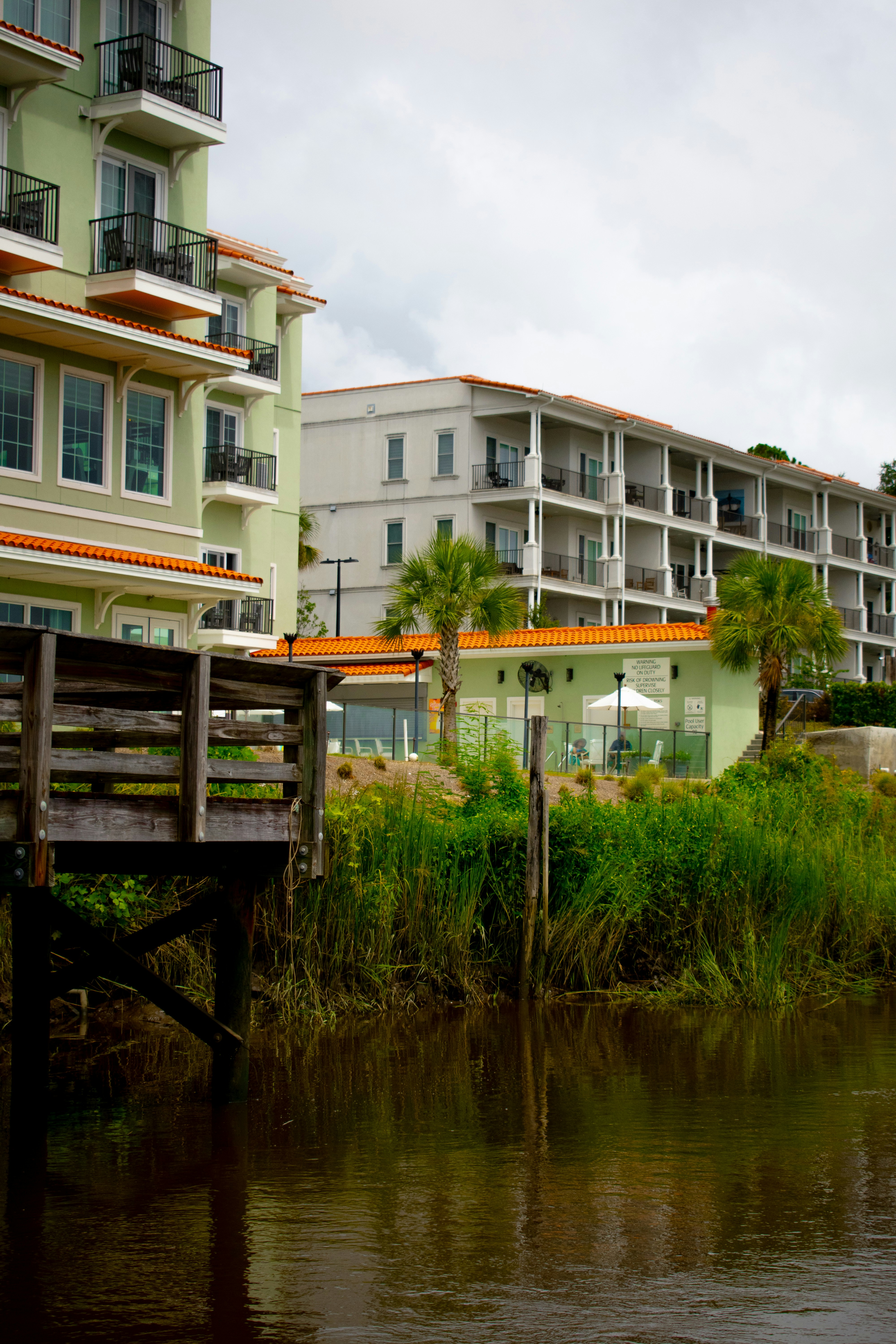 Colorful Coastal Village: Apartment Blocks Rising Over Wetland Trails