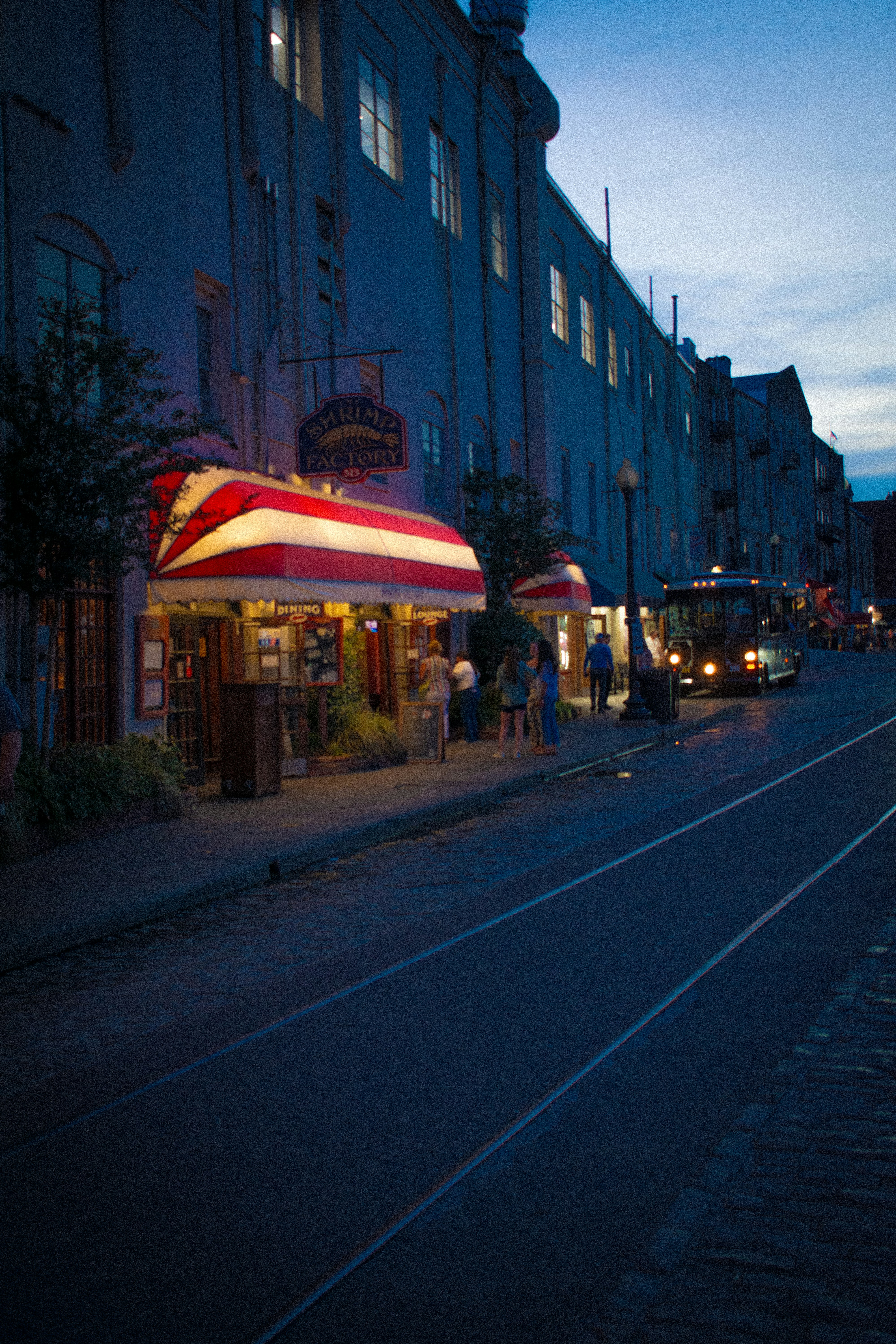 Evening Neon on a Quiet Main Street