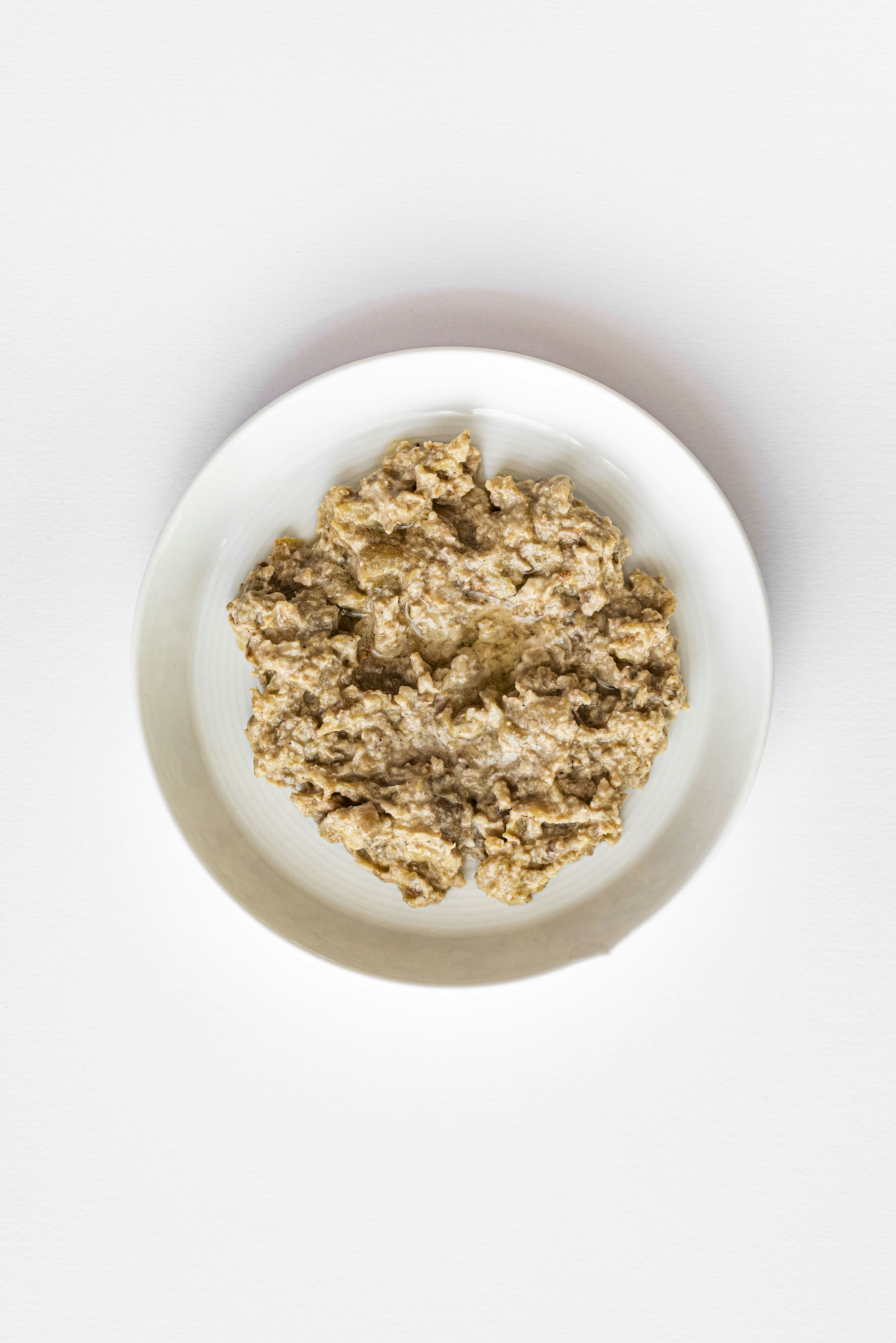 Crumbled Granola Crown: A Minimal Bowl on White