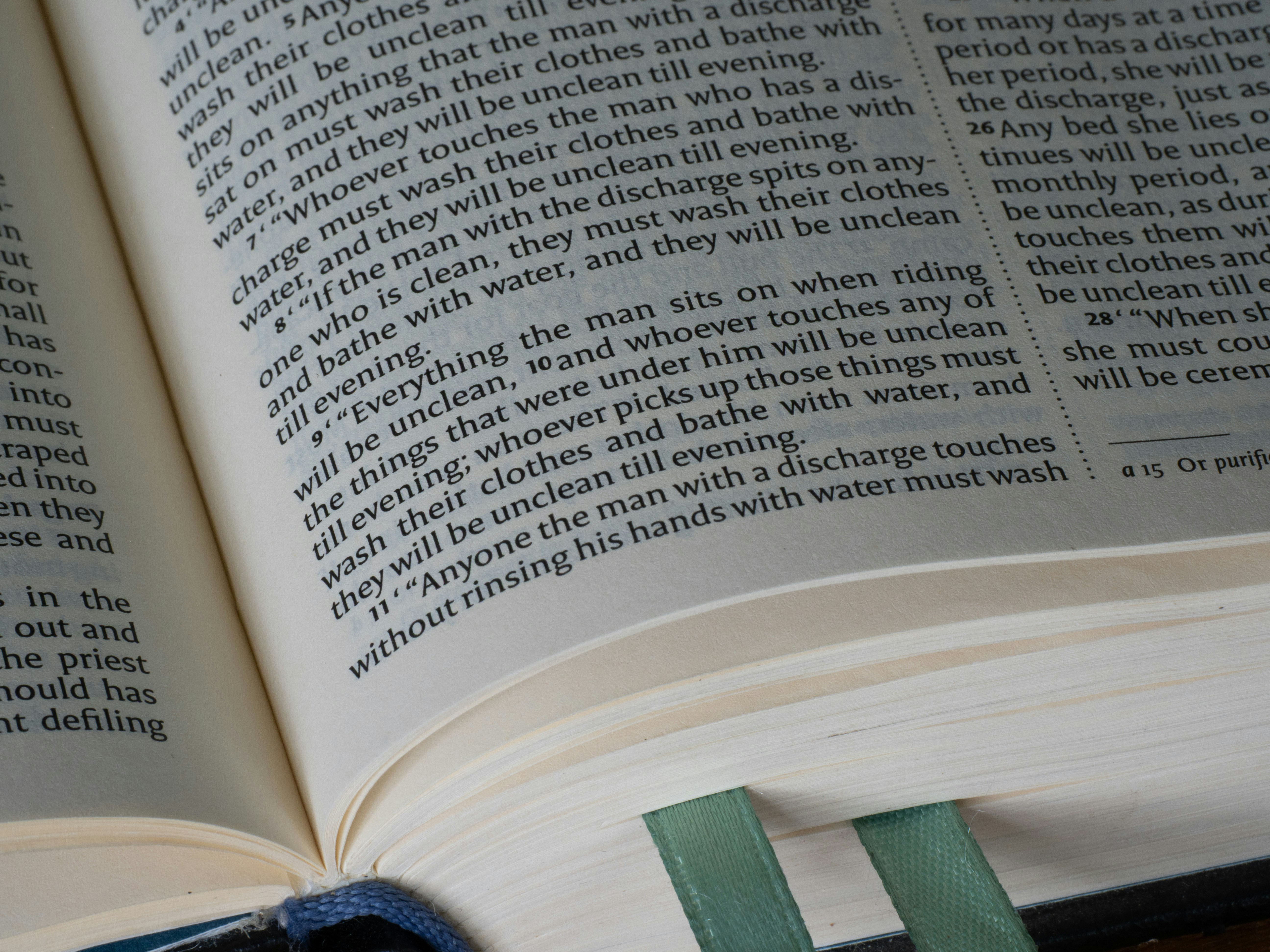 An Open Page: A Close-Up of a Book’s Bound Spine and Ribbon