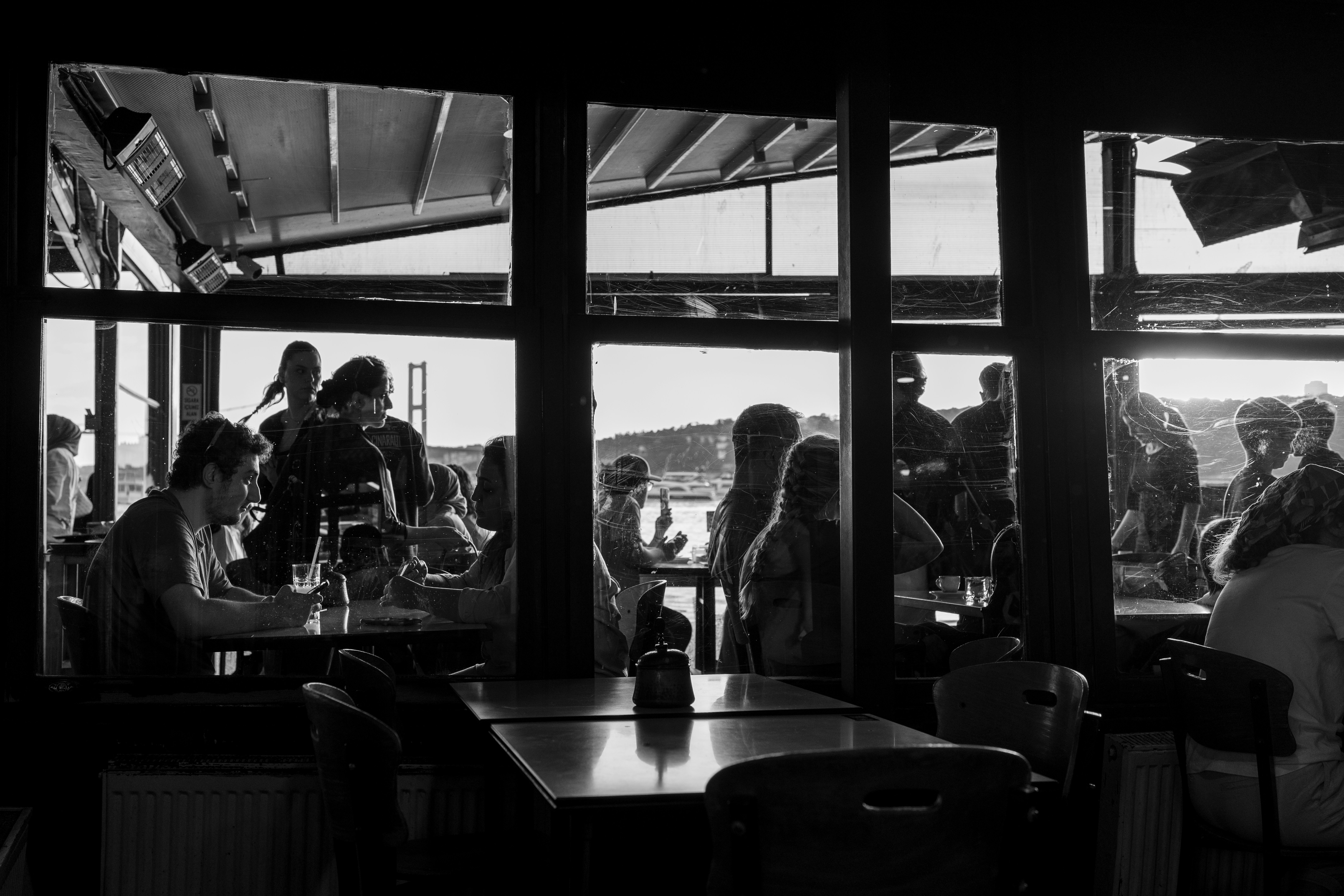 Silhouette Through a Window: Café in Soft Backlight