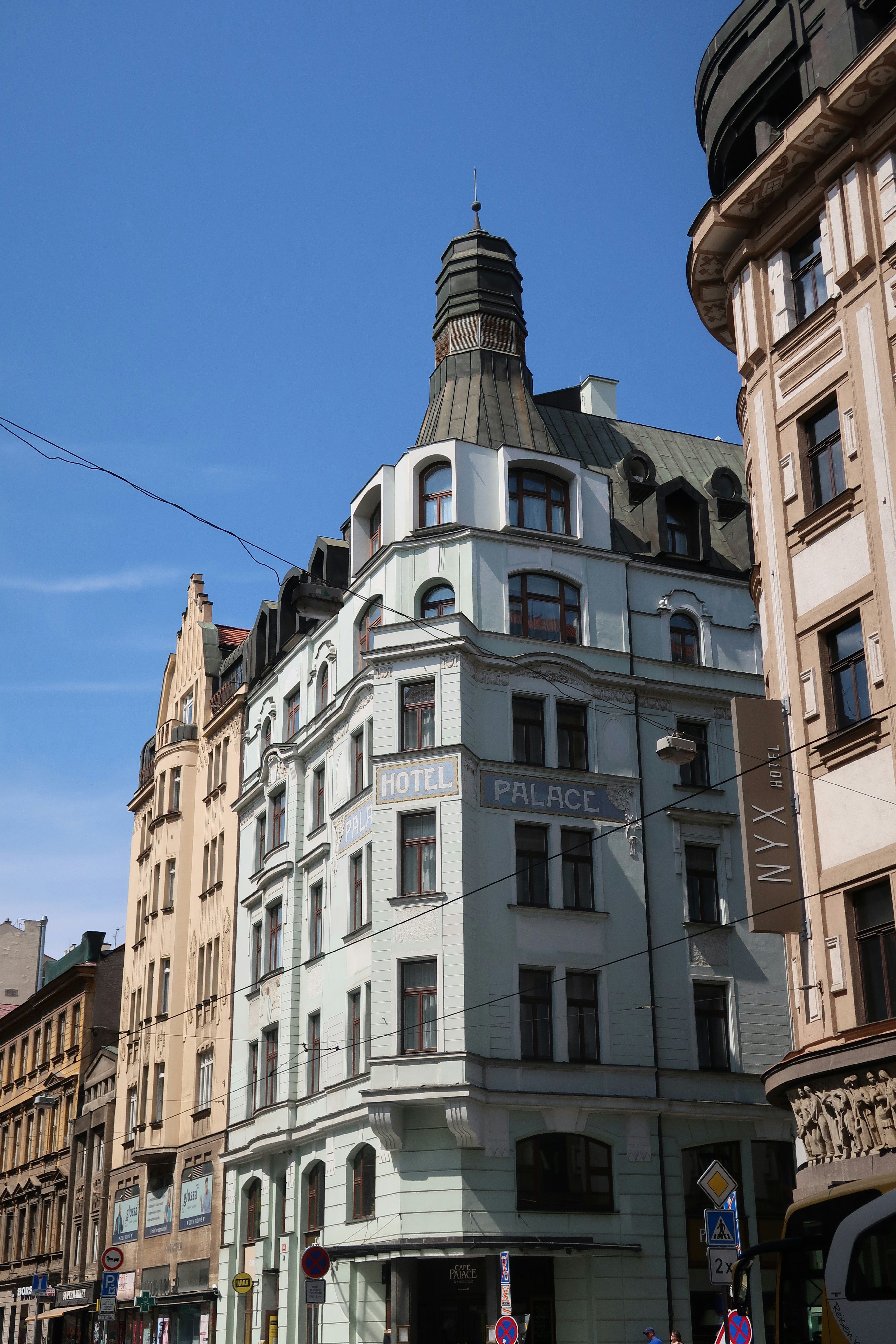 Pastel Hotel Row Under a Clear Urban Sky