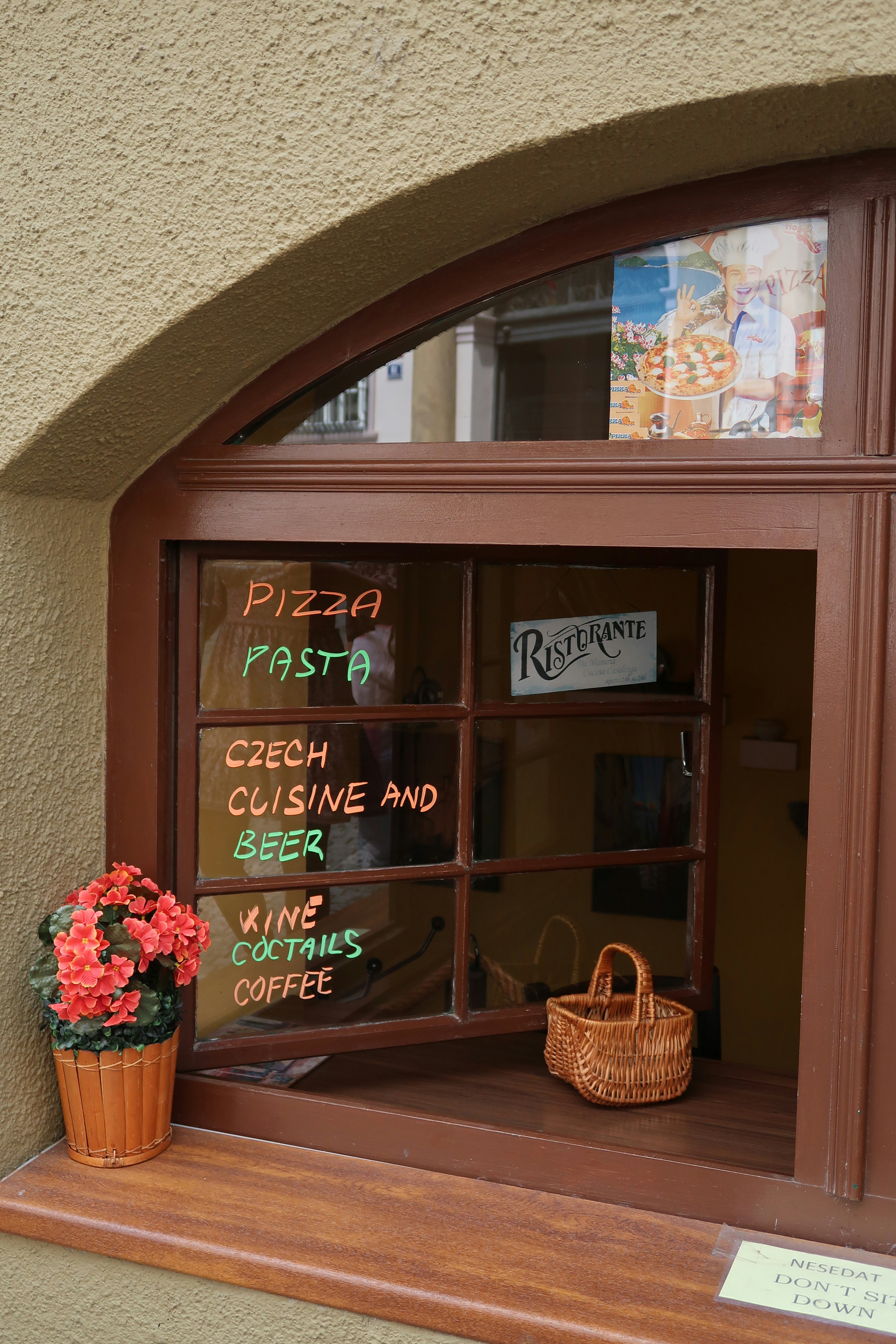 Pizza Sign in a Cozy European Café Window