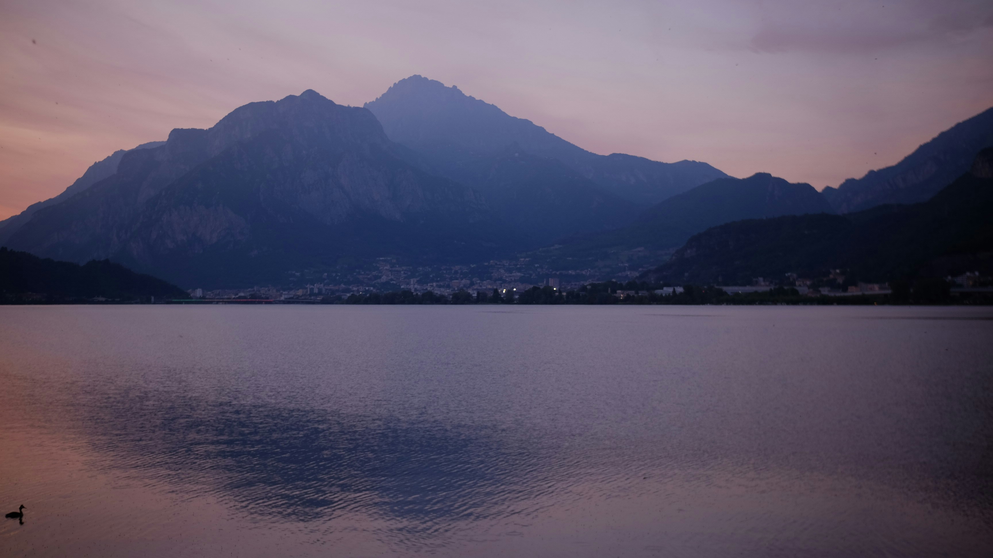 Dusk on the Lake: Silhouetted Range Over Calm Waters