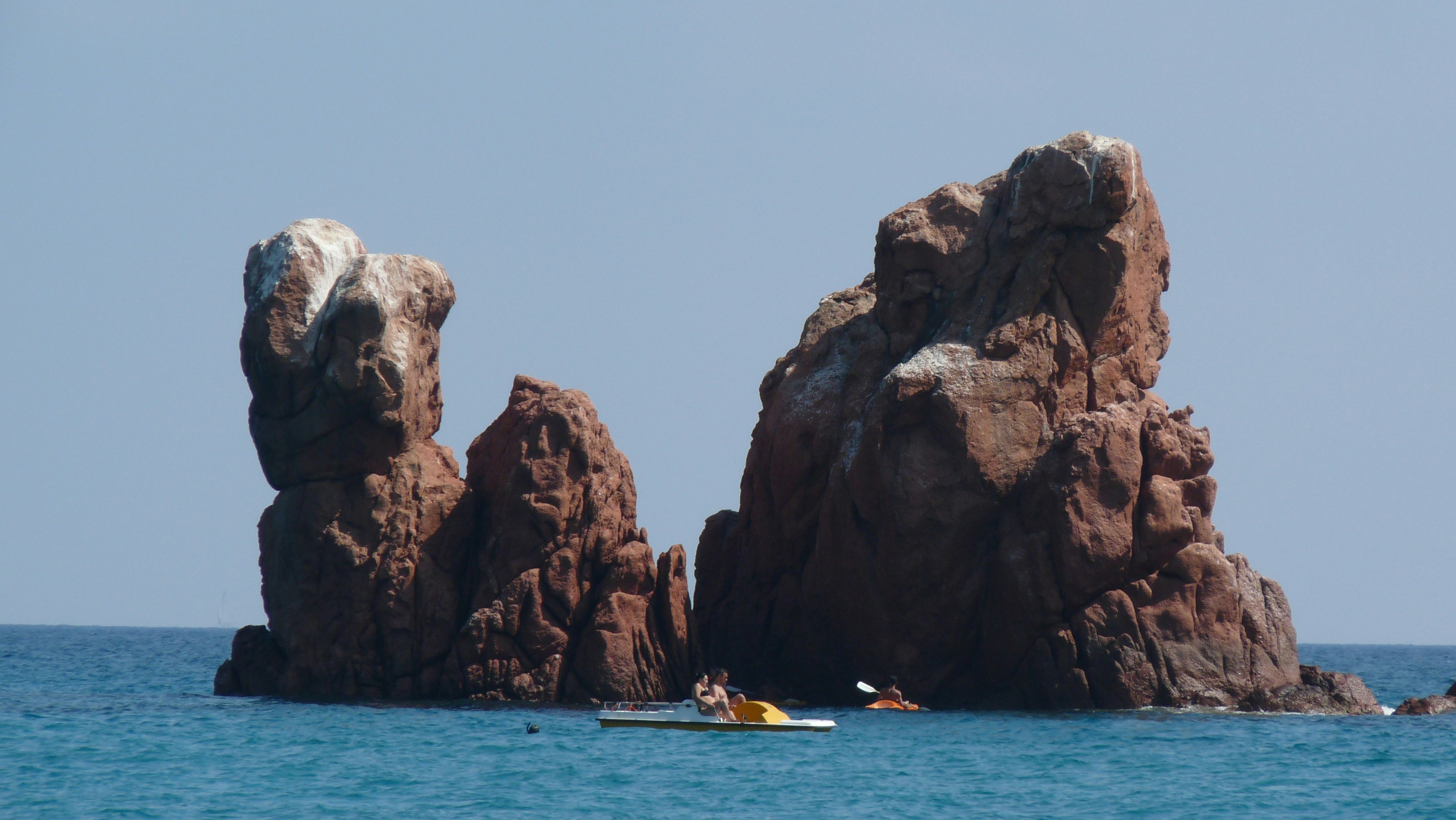 Twin Sea-Stone Spires Rising from Calm Aquamarine