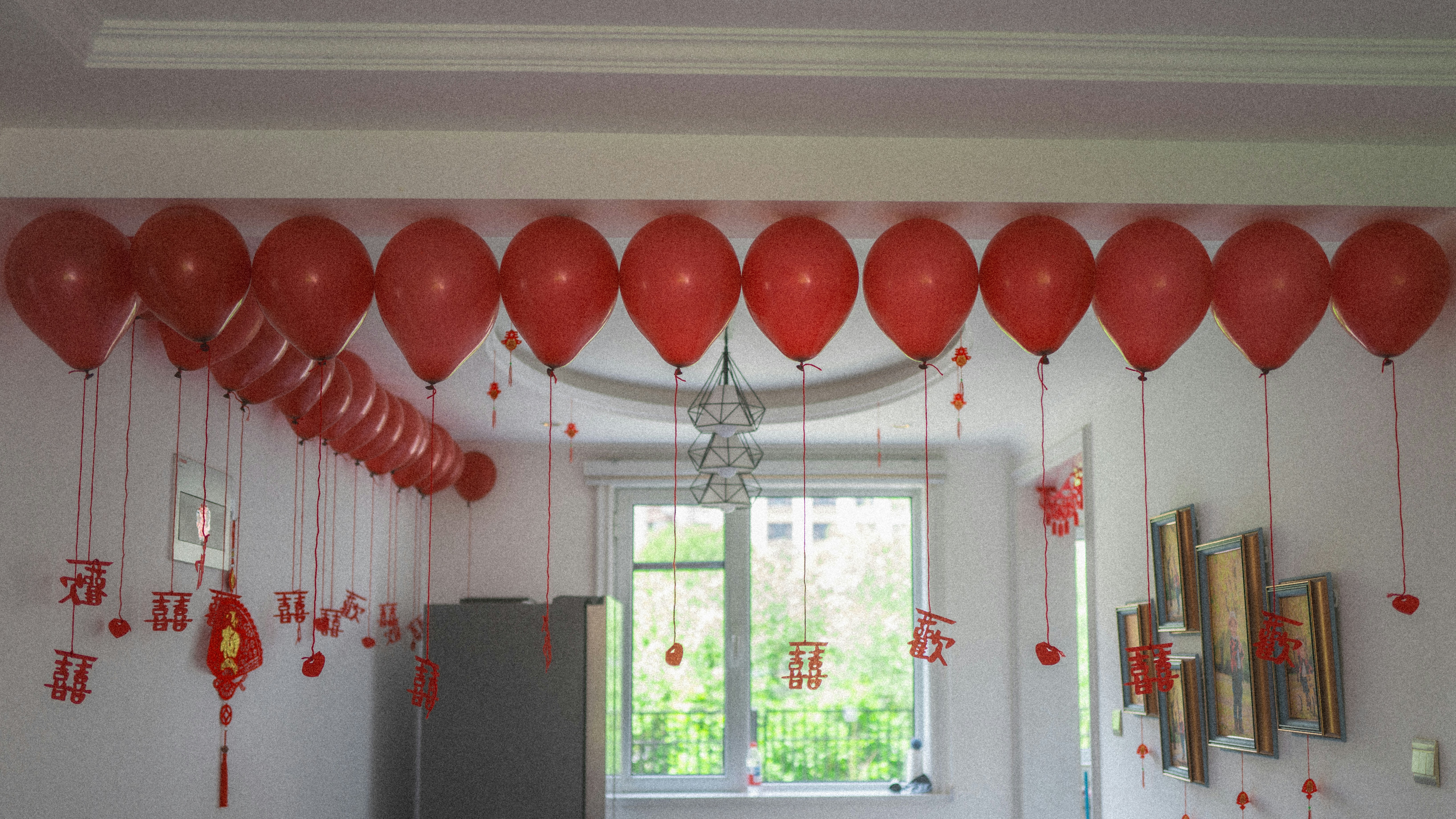 Red Lanterns and Balloons: Festive Ceiling of a Bright Room