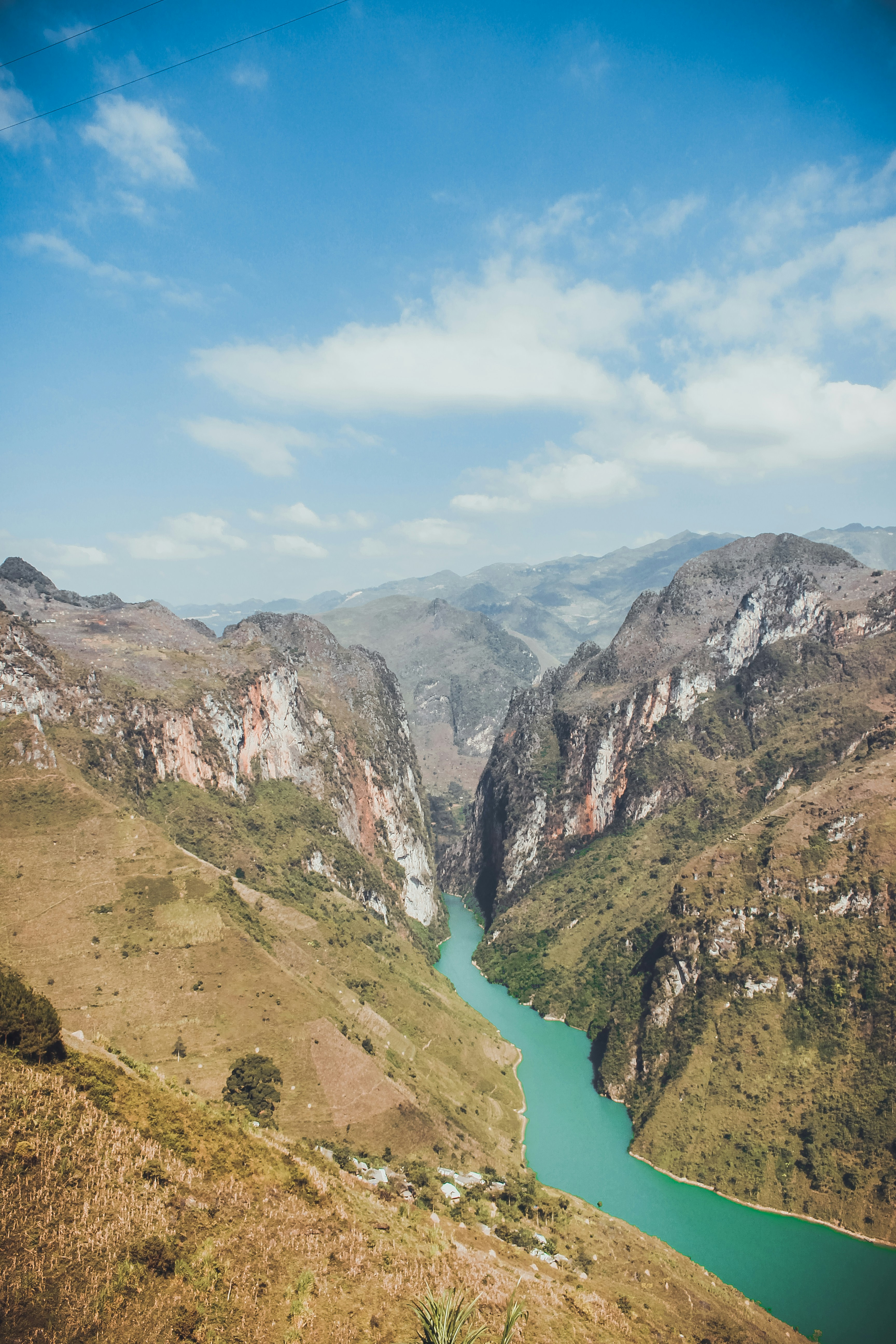 River Meander Through a Limestone Gorge Under a Clouded Sky