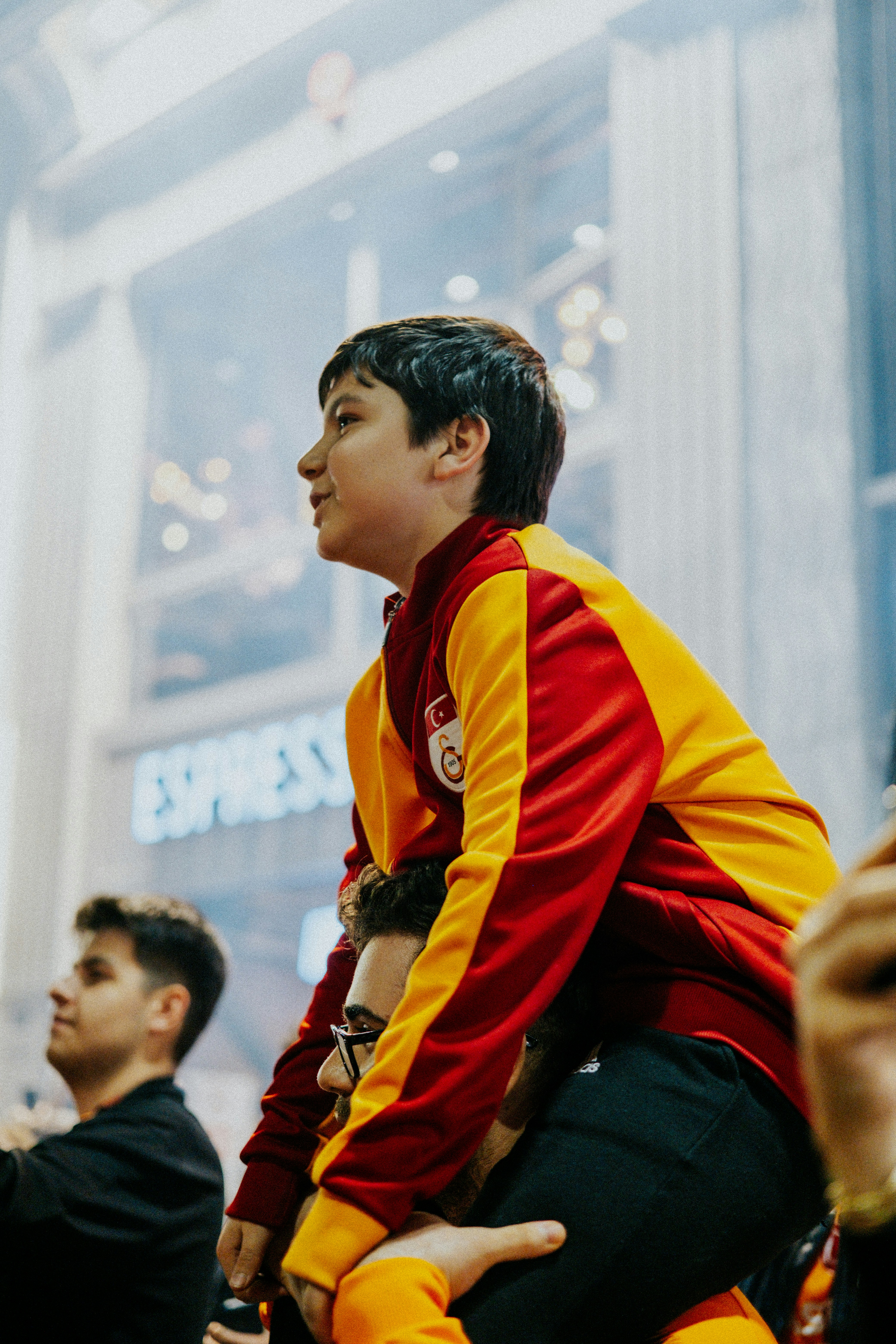 Youthful Silhouette: A Young Acrobat Surges Above the Crowd