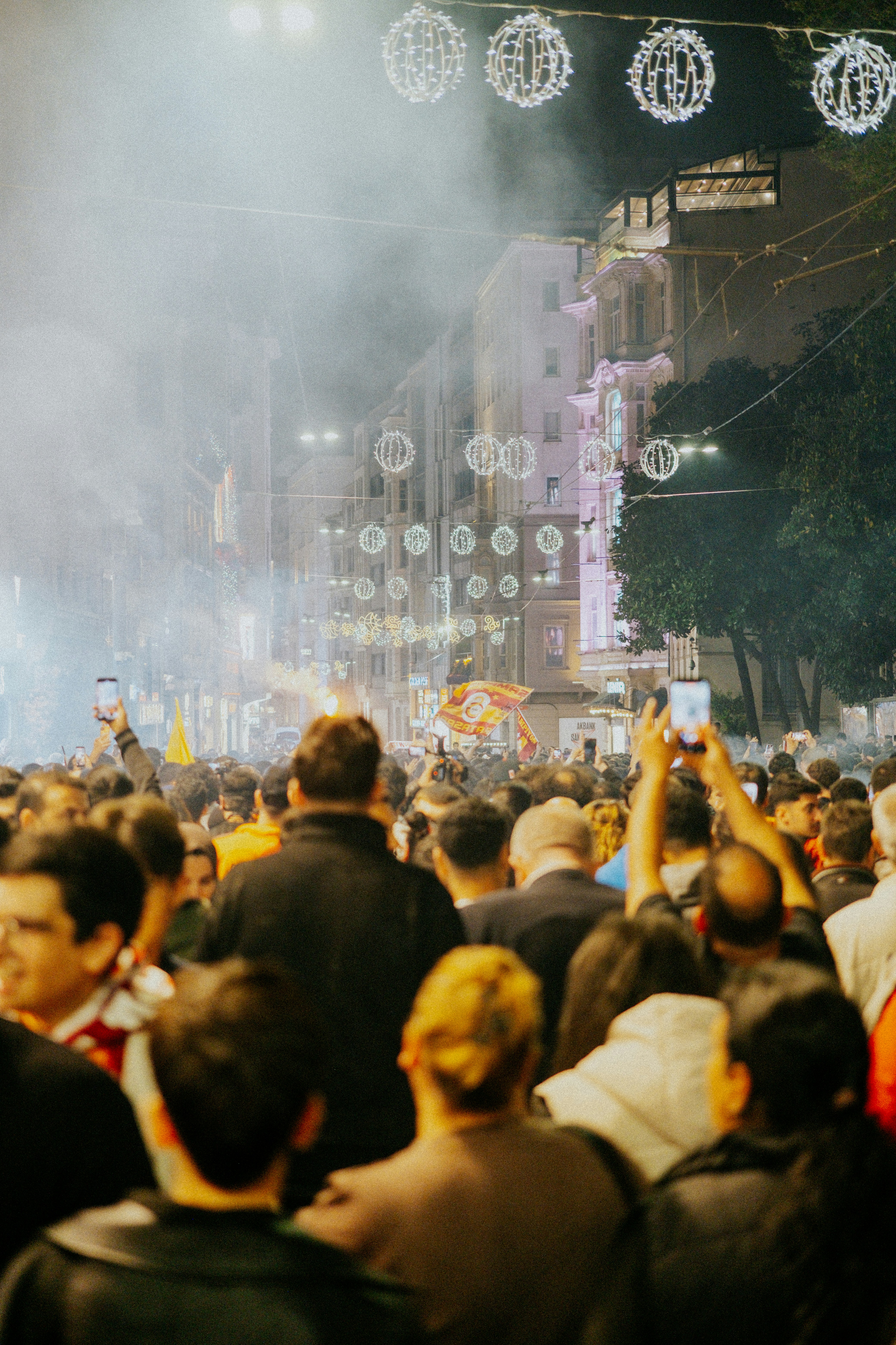 Night Parade Under Circular Ornaments: A City Celebrates