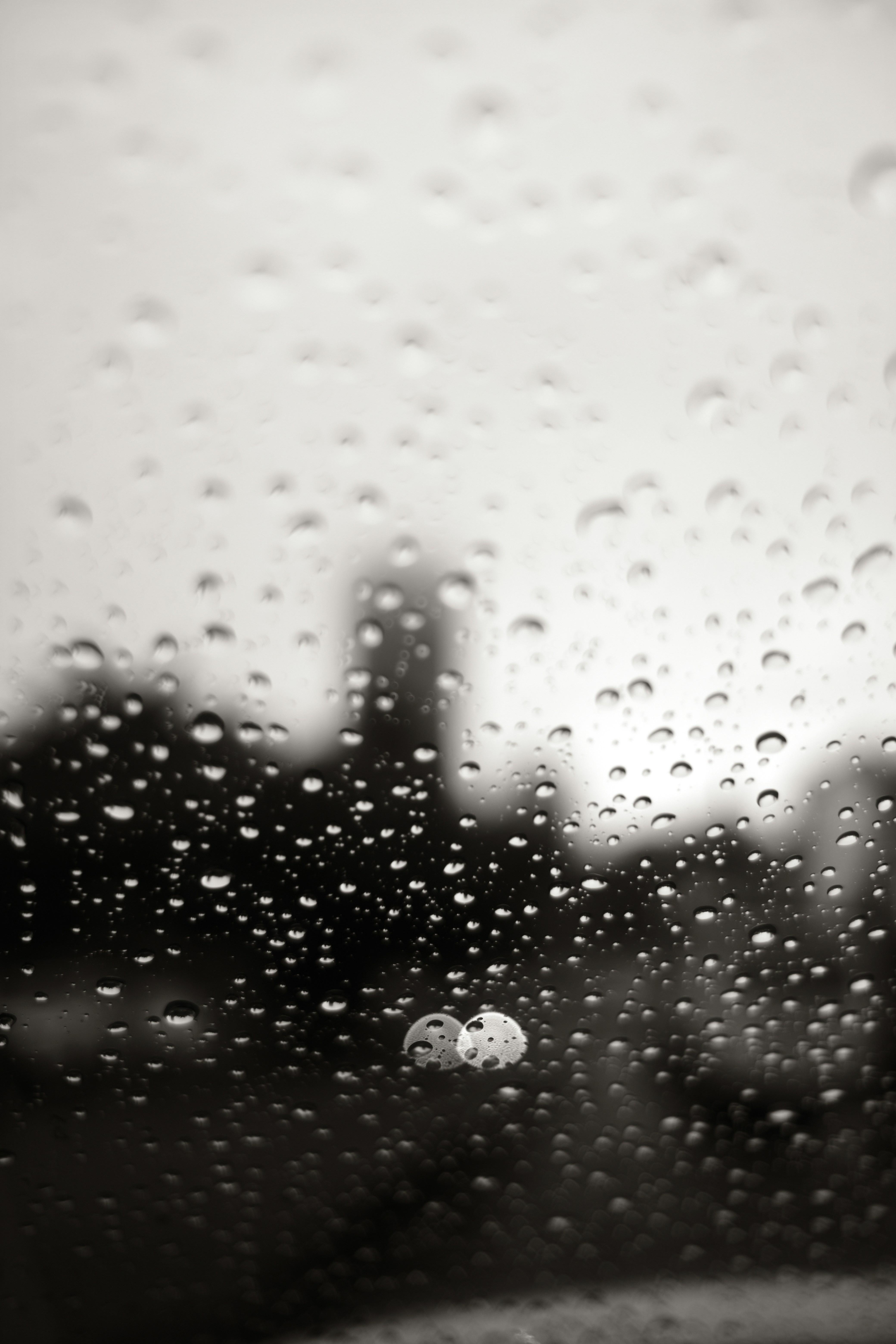 Rain-dusted Window City Silhouette