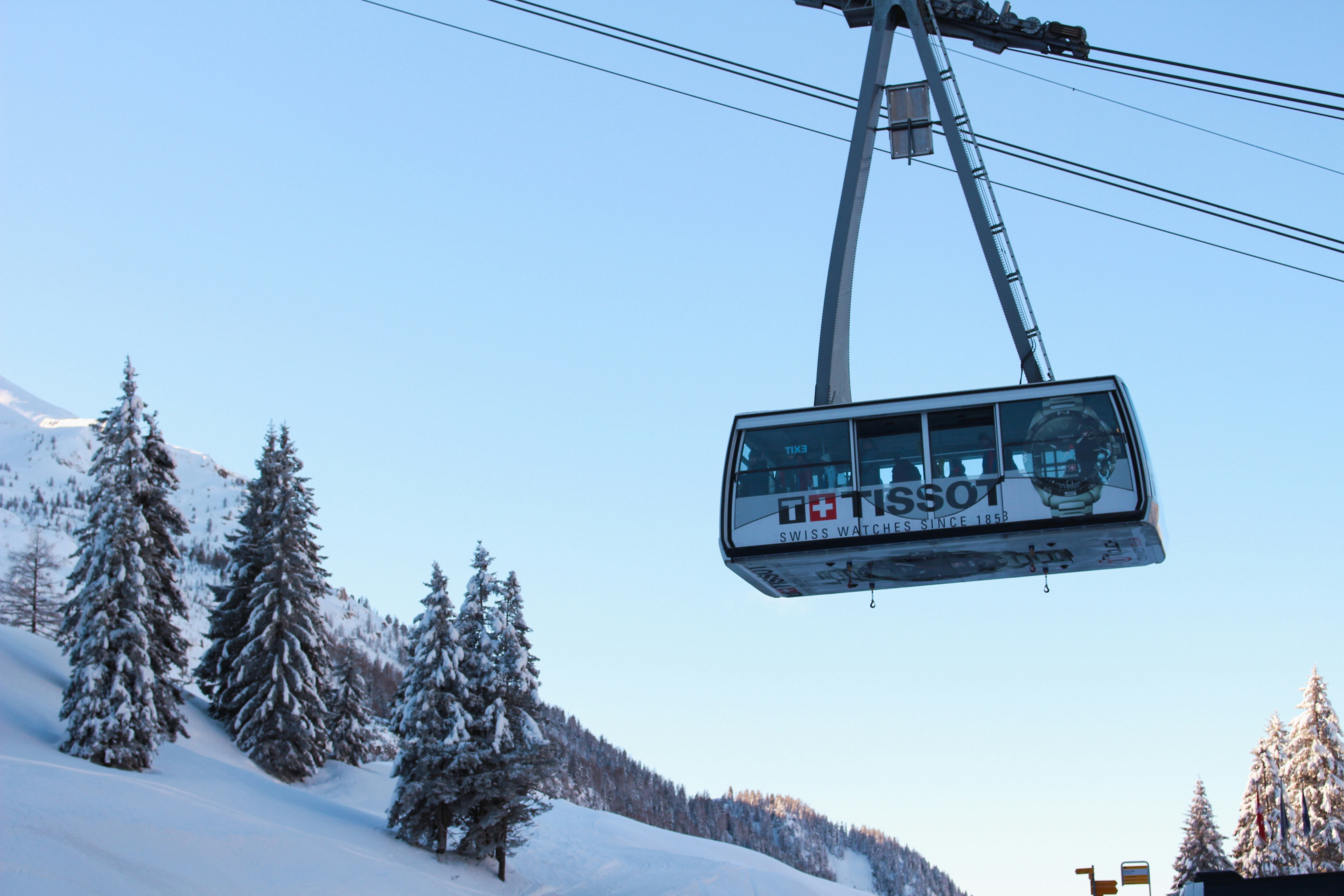 Snowbound Lift: A Cable Car Carves Through Alpine Silence