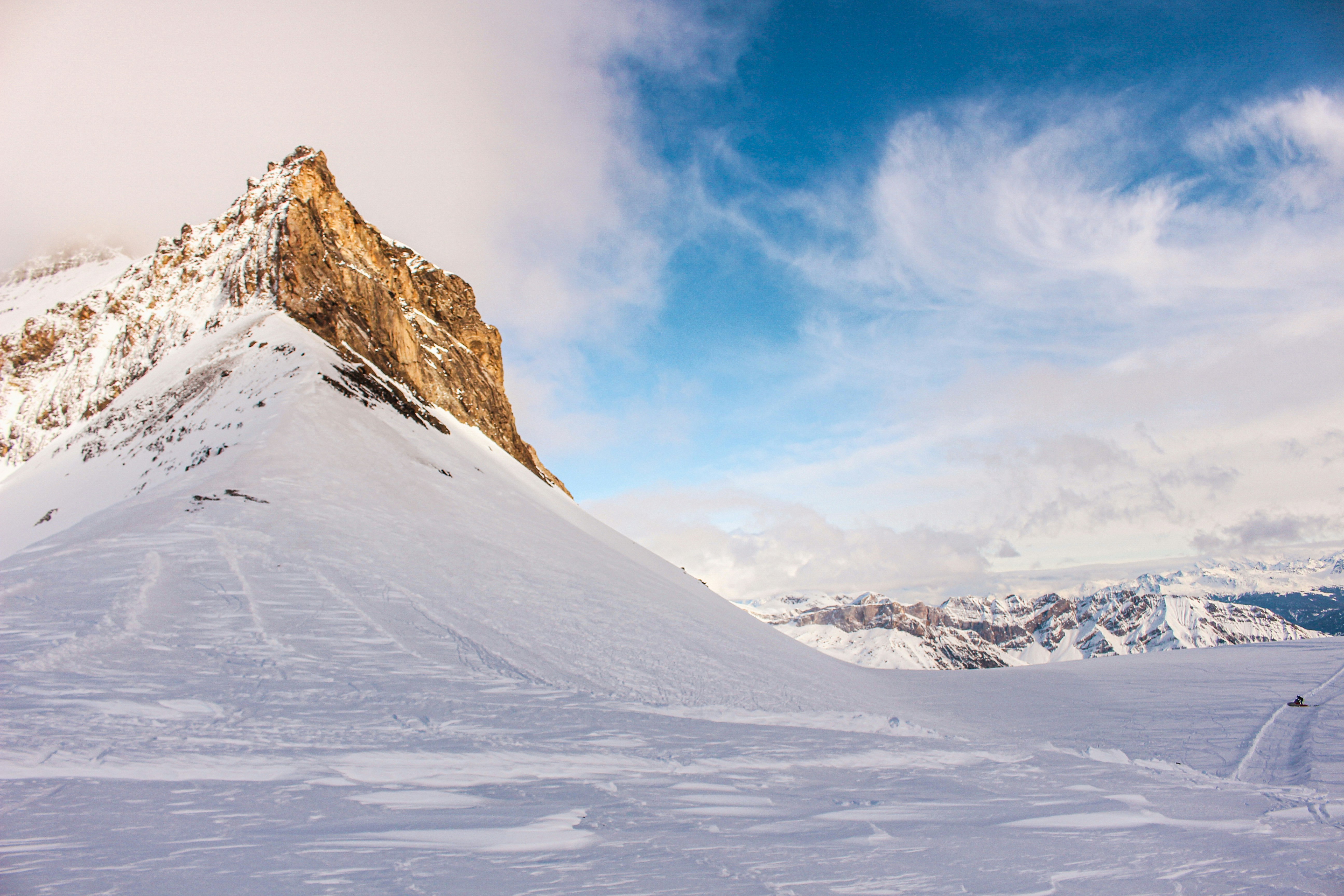 Snow Peak at Dawn: A Quiet Horizon Beneath a Blazing Sky
