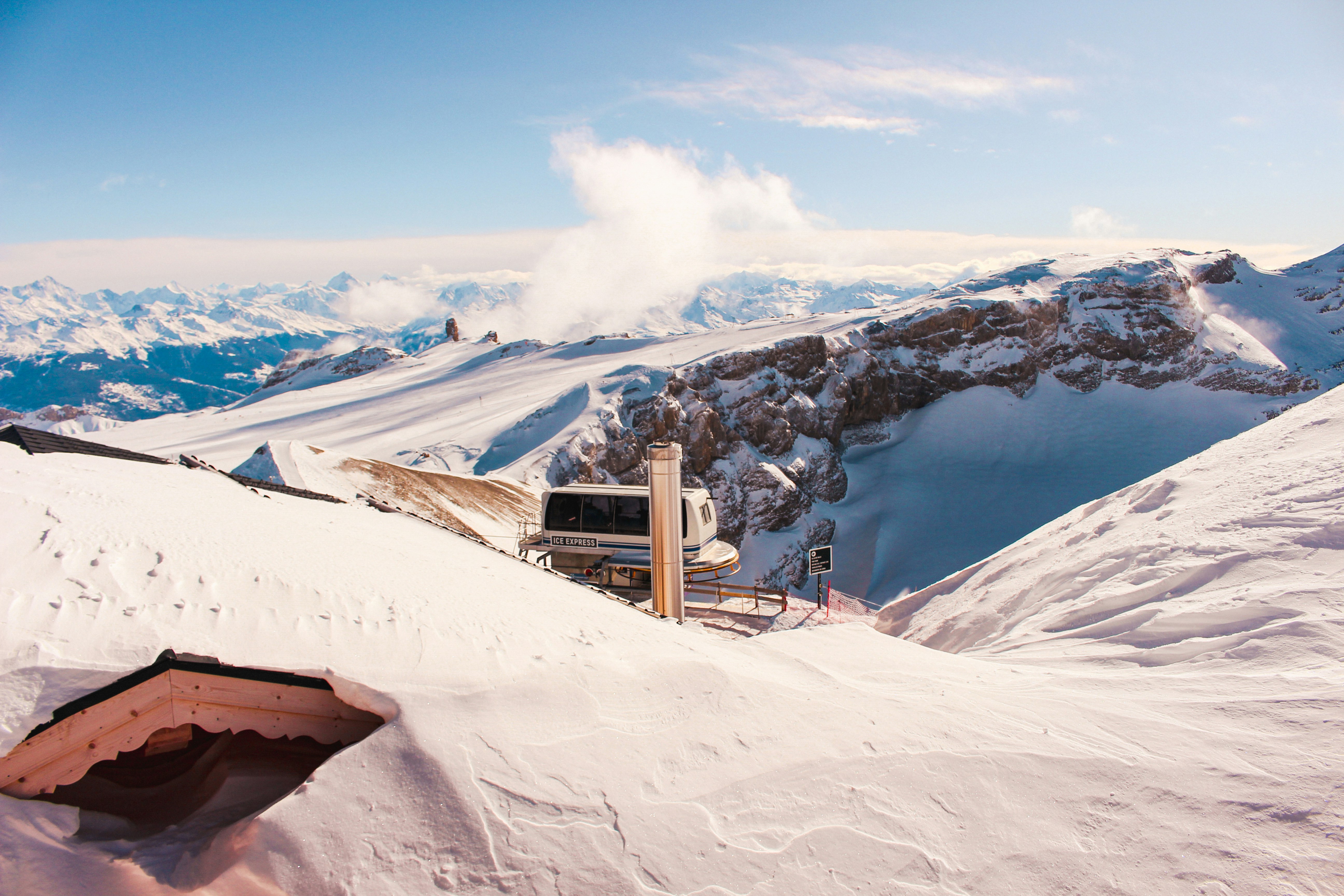 Snowbound Runway: ACable Car Hut Amid Alpine Blanc
