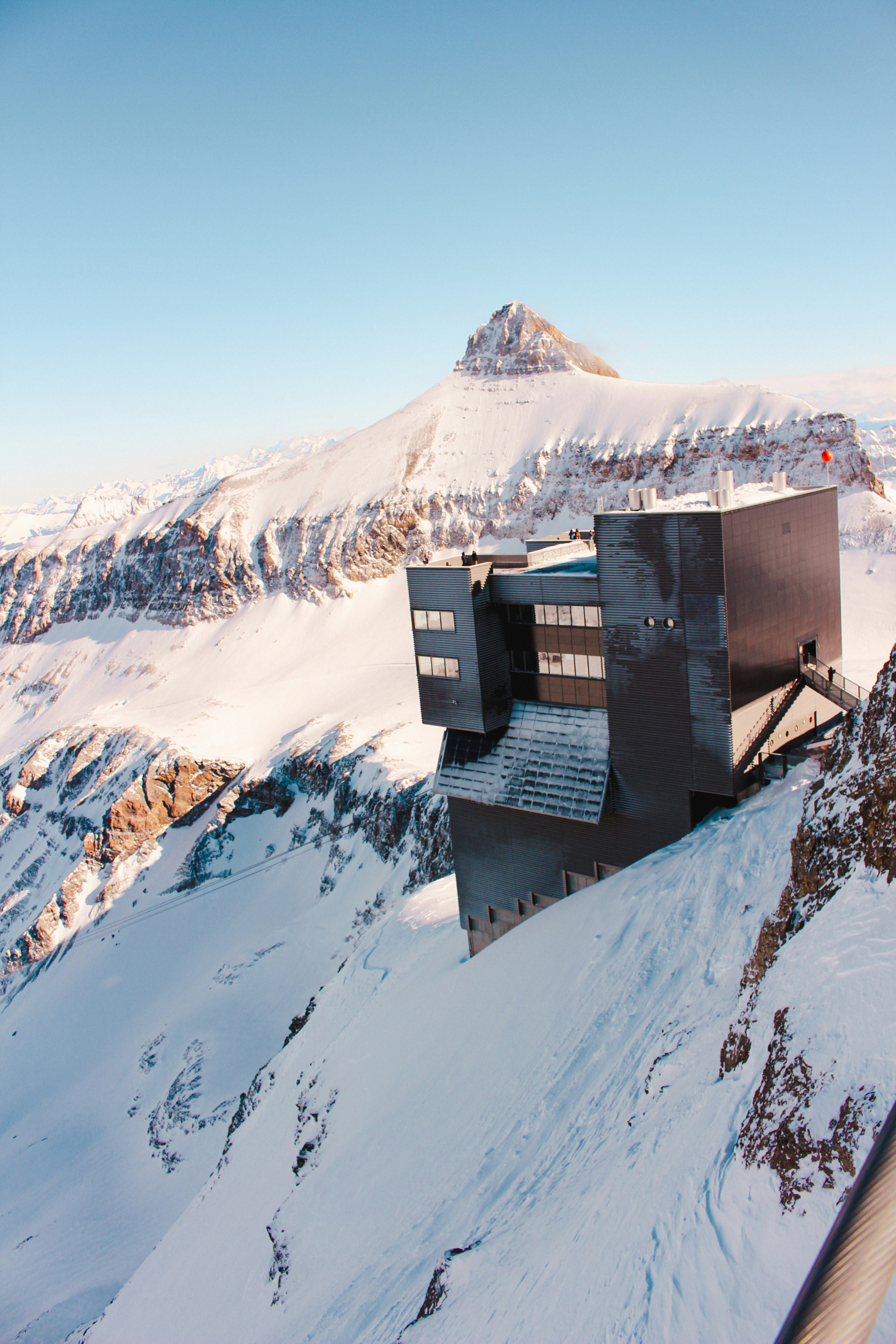 Snowbound Summit: The Modern Cliffside Observatory