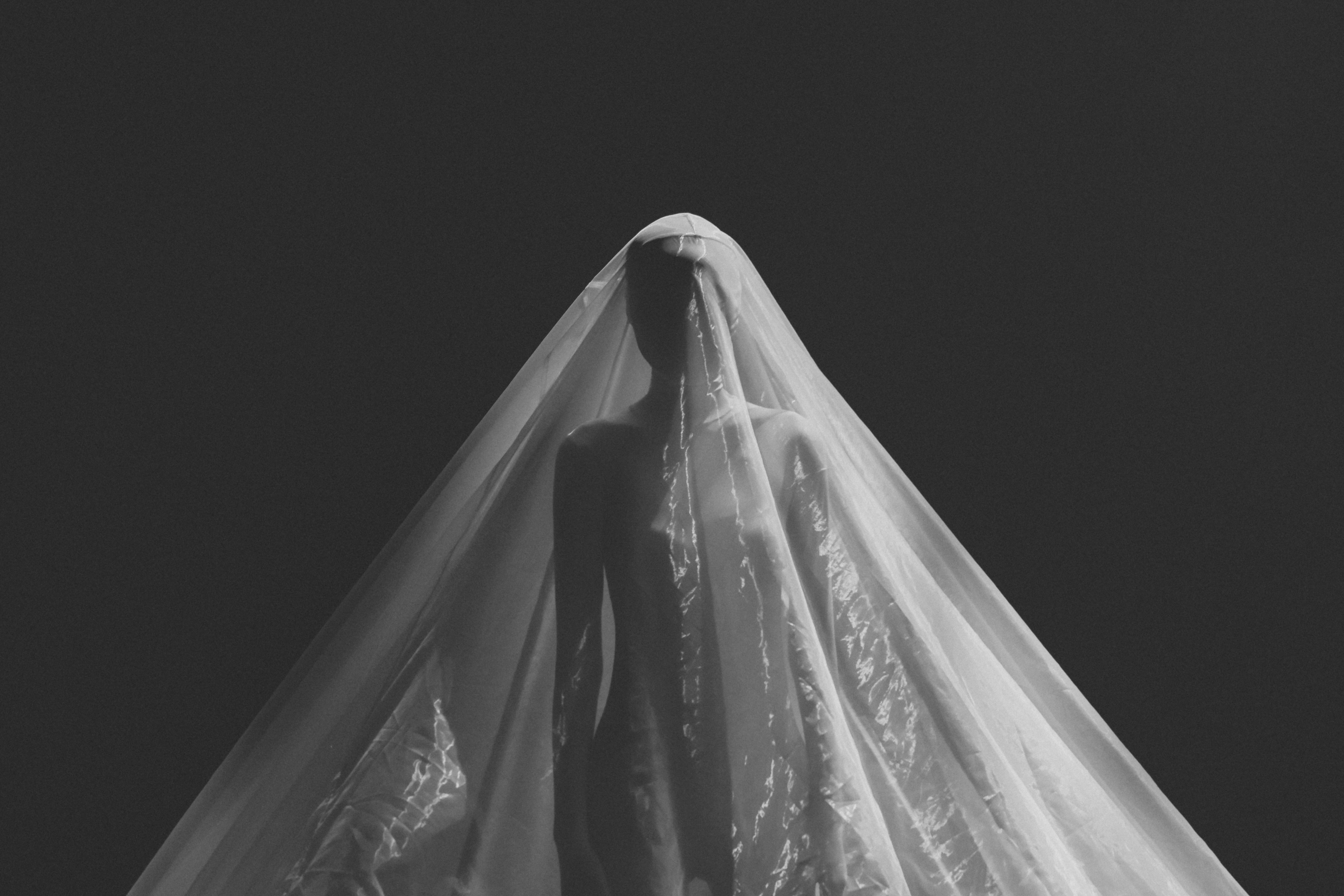 Veiled Bride on a Peak: A Ghostly Portrait in Veil and Light