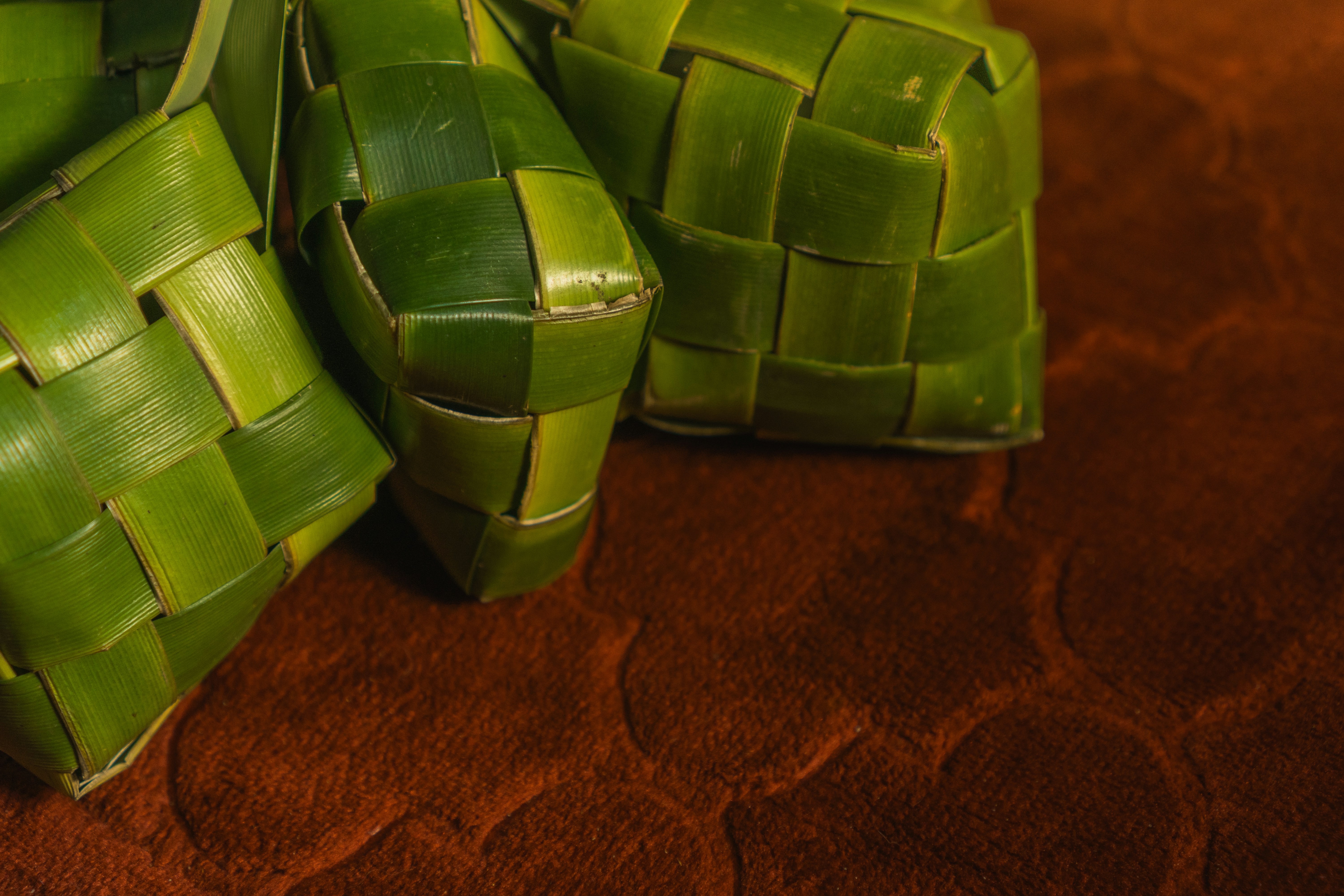 Woven Green Petals on Leather Surface