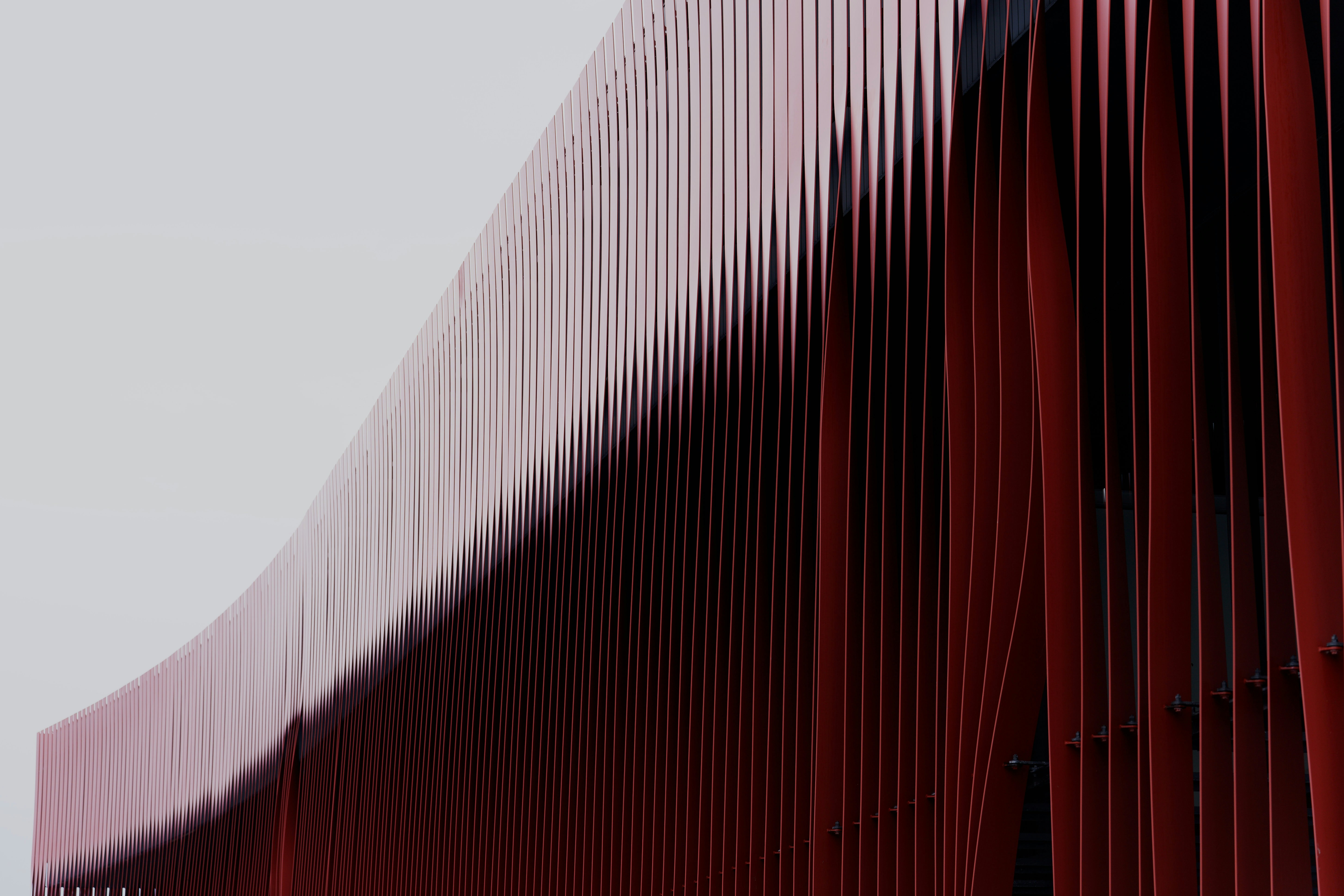 Red Vertical Rhythms: A Facade of Repetitive Peaks