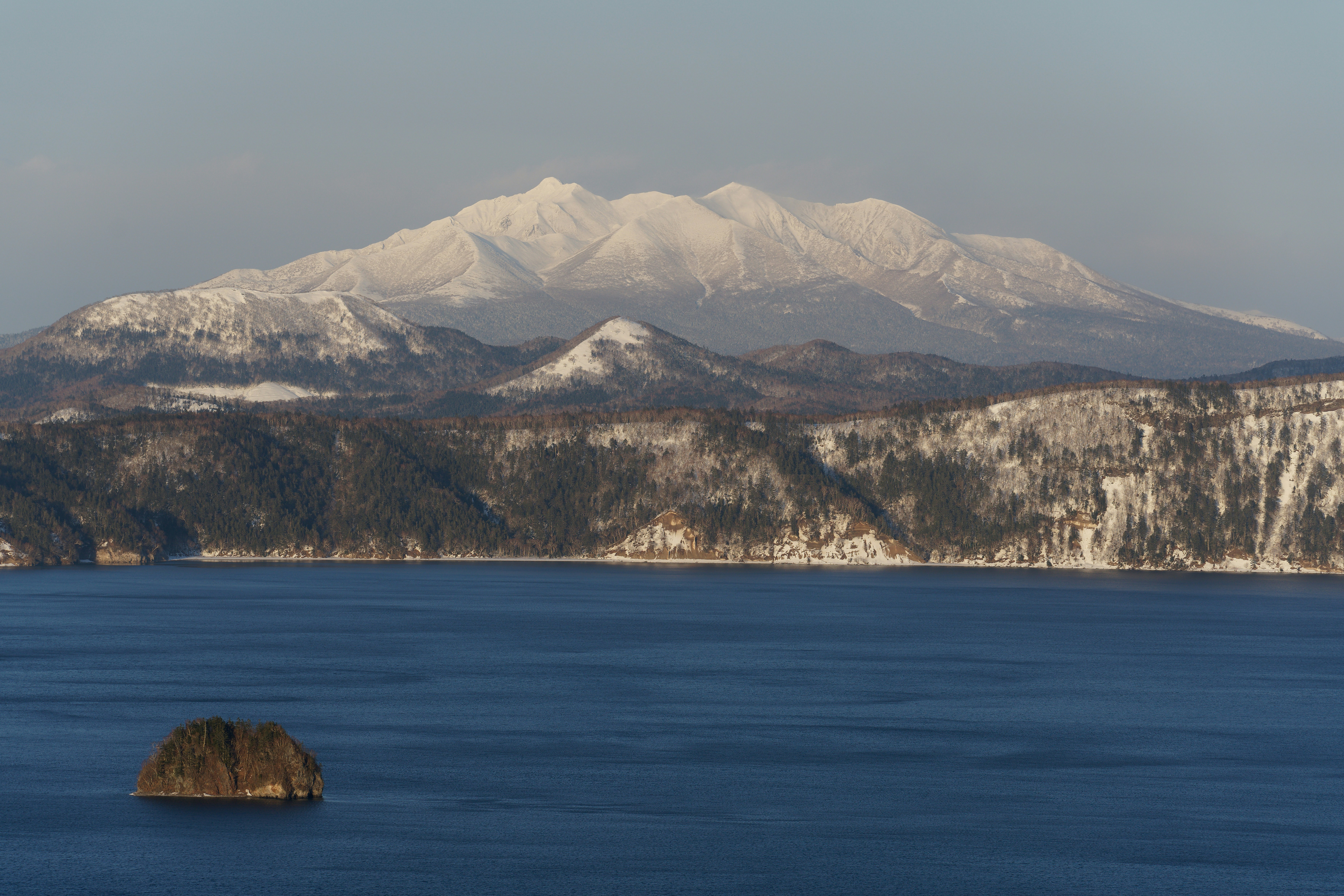 Azure Fjord Under Snowbound Peak