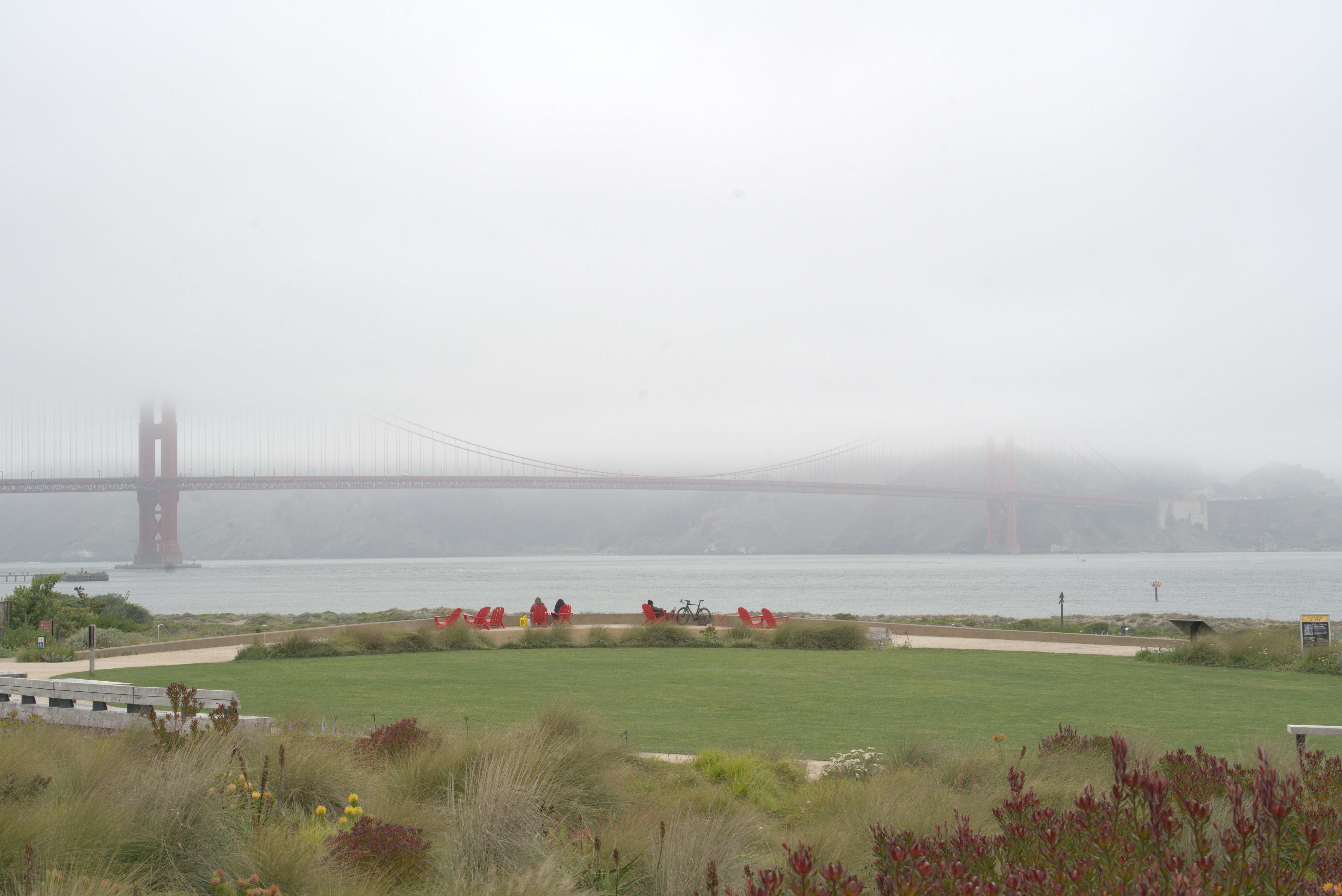 Bridge silhouette over misty shoreline