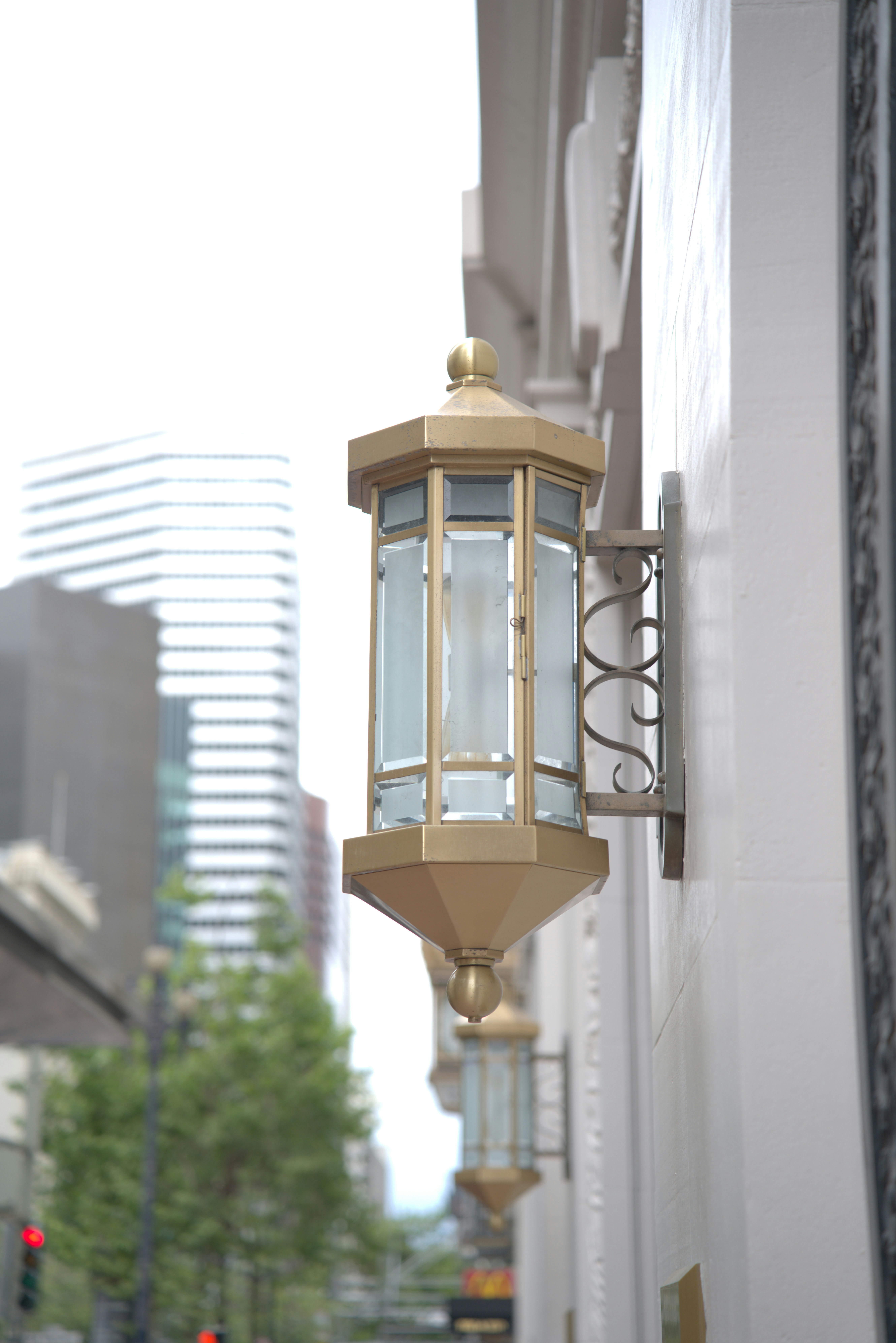 Golden Lanterns: Urban Facade Lighting Along a Quiet Street