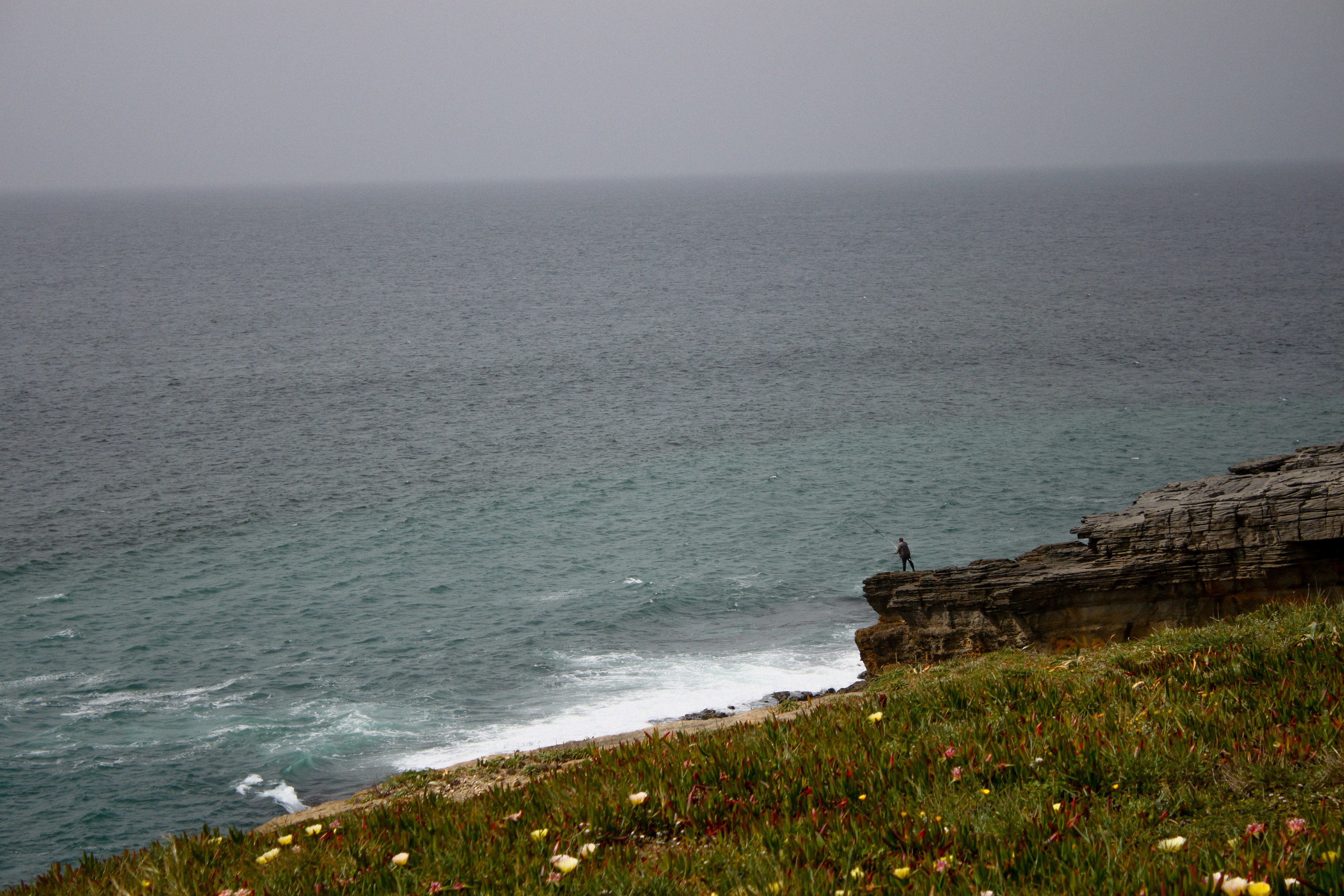 cliffside lookout over a misty sea