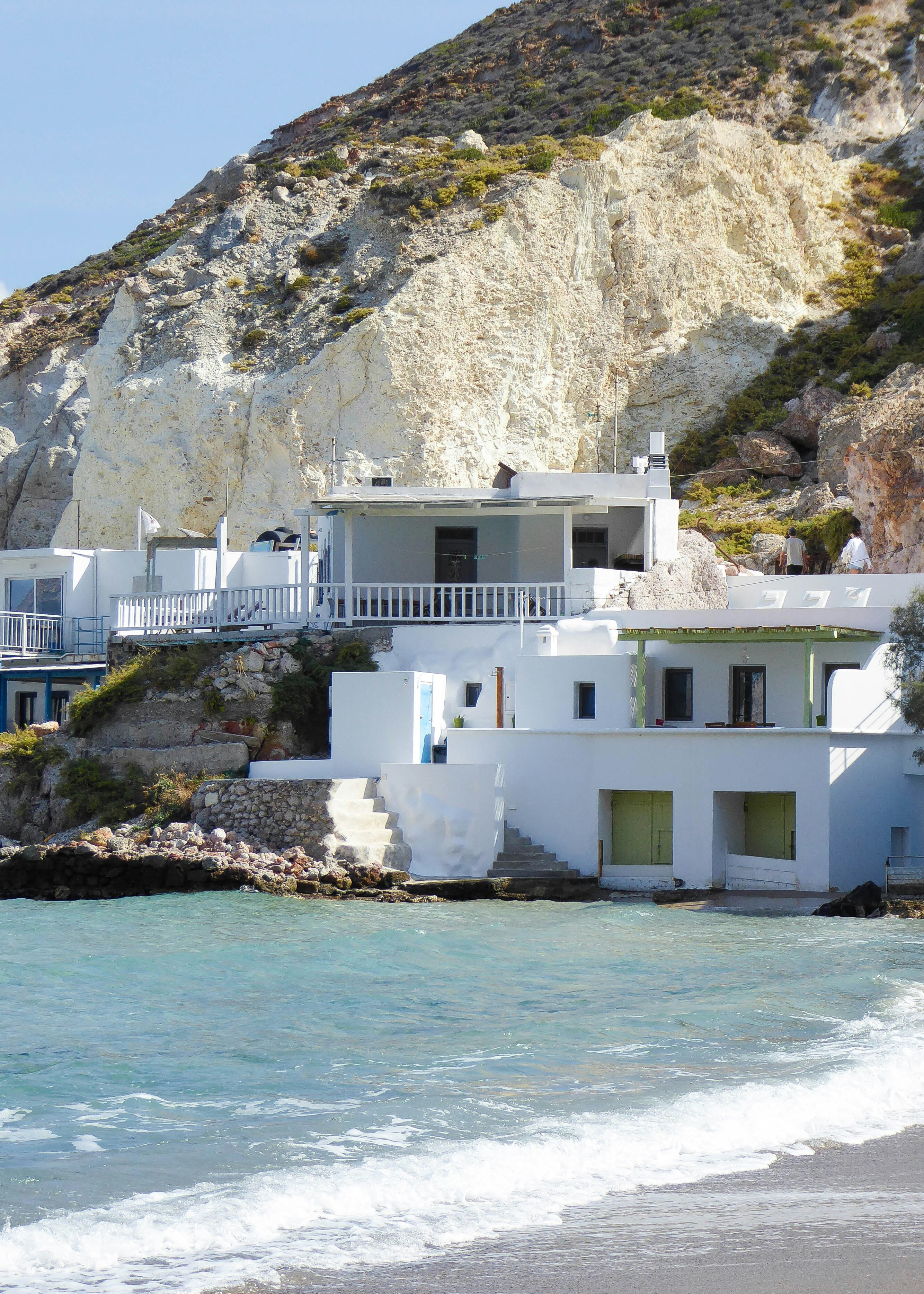 Coastal Whitewashed Haven Nestled Against a Cliff