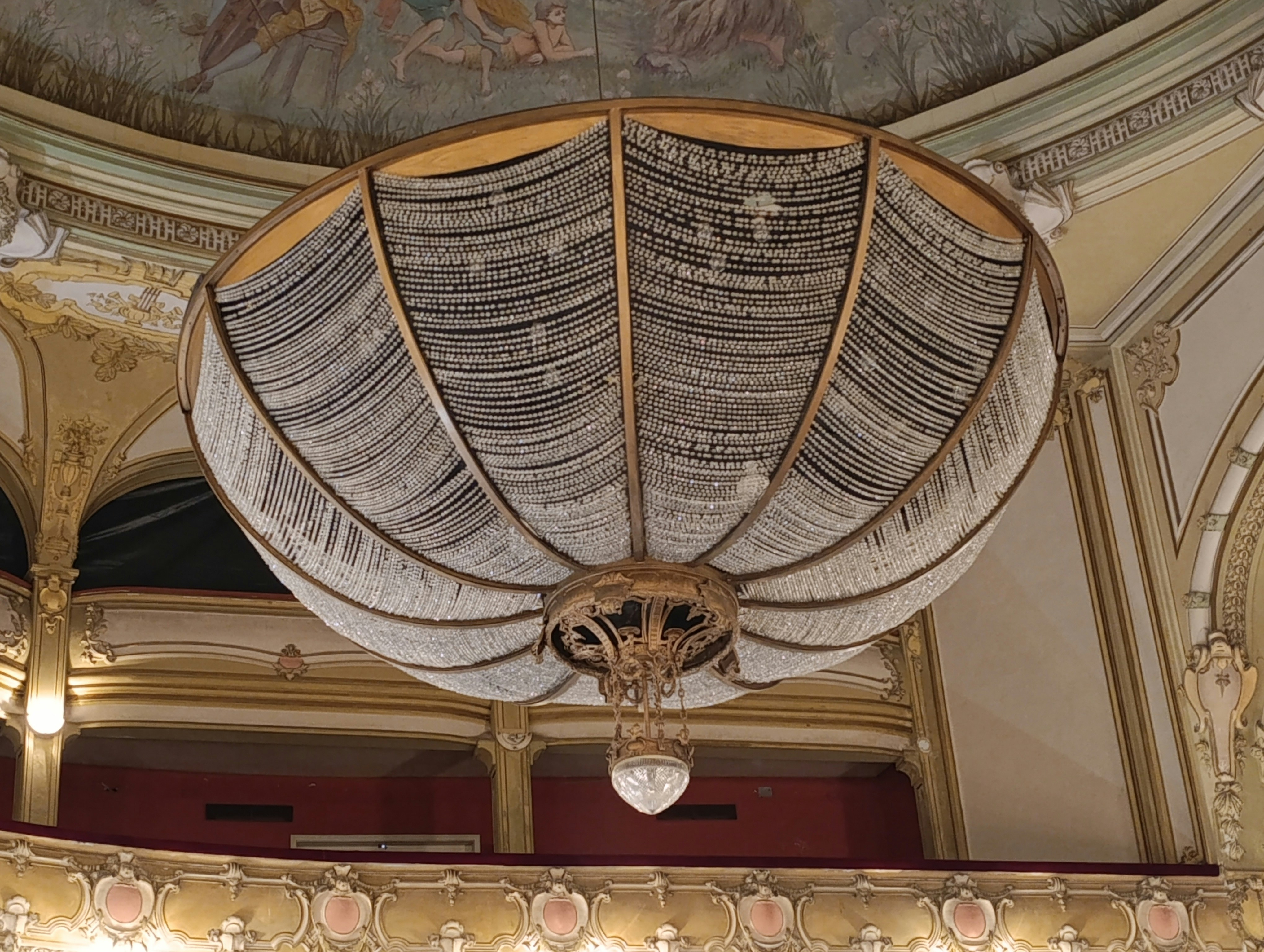 Ornate Chandelier Centerpiece Adorned by Painted Vaults