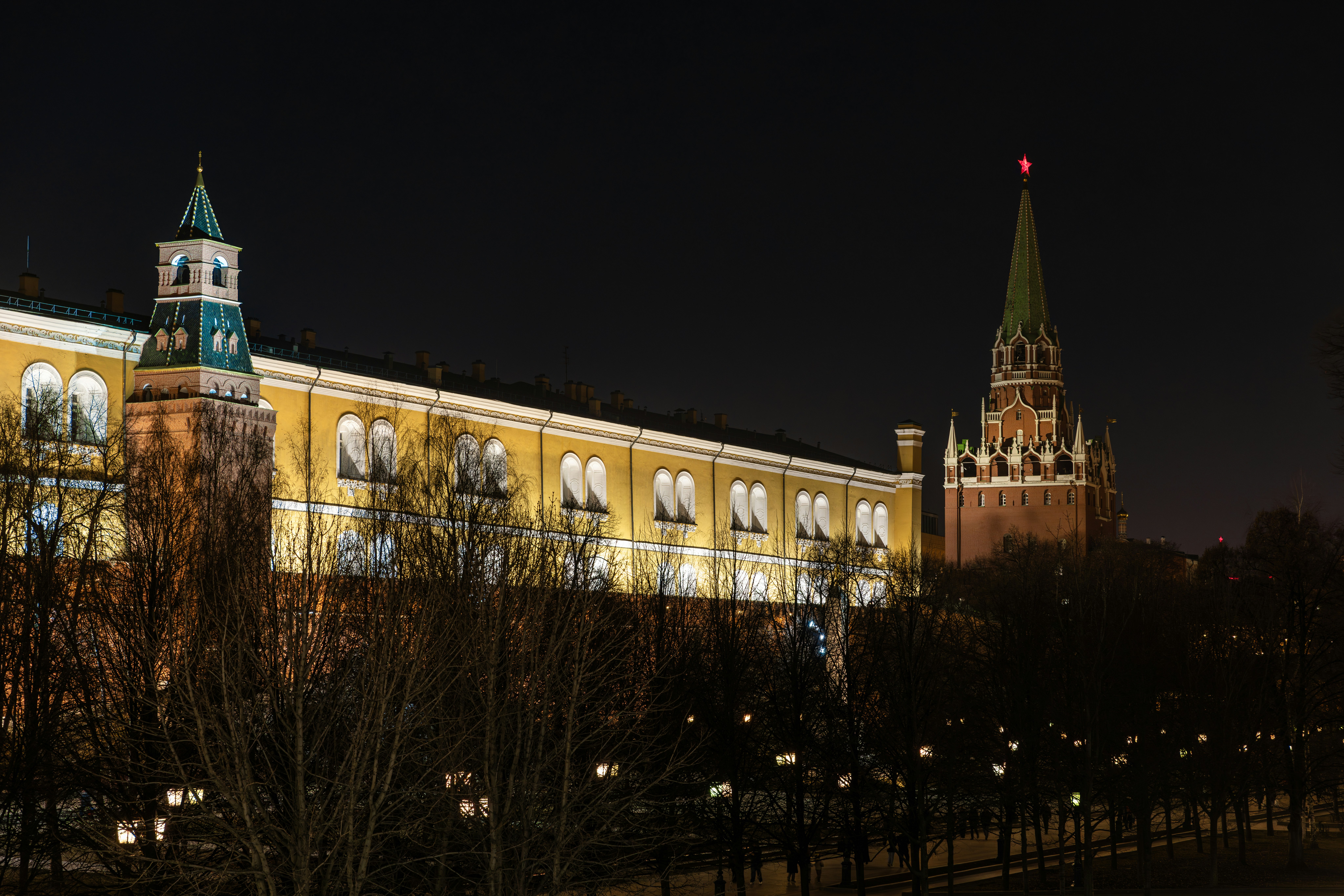 Nighttime Kremlin glow: illuminated walls and tall spire