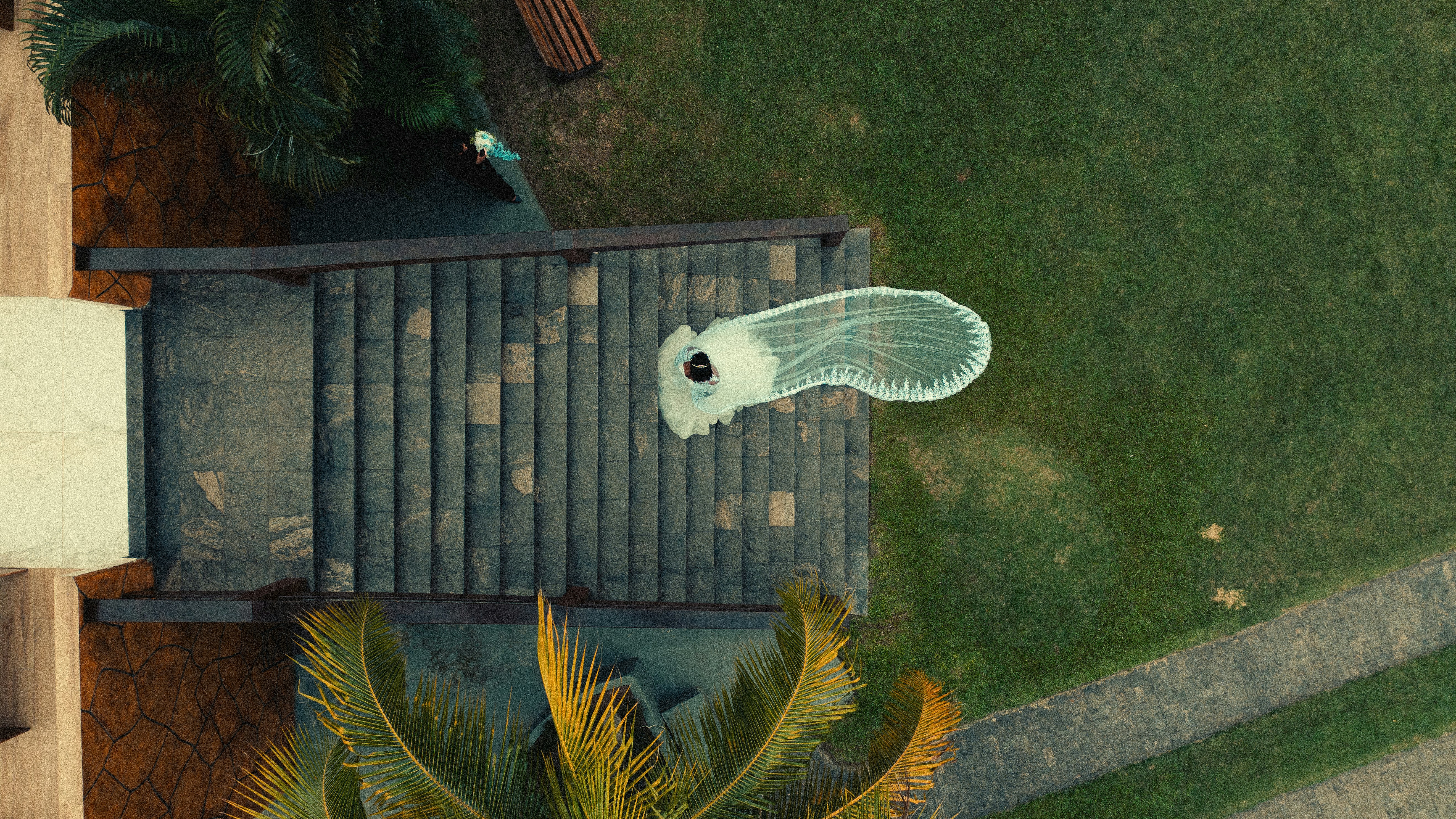 Aerial Pause: caretaker on the stairwell from above