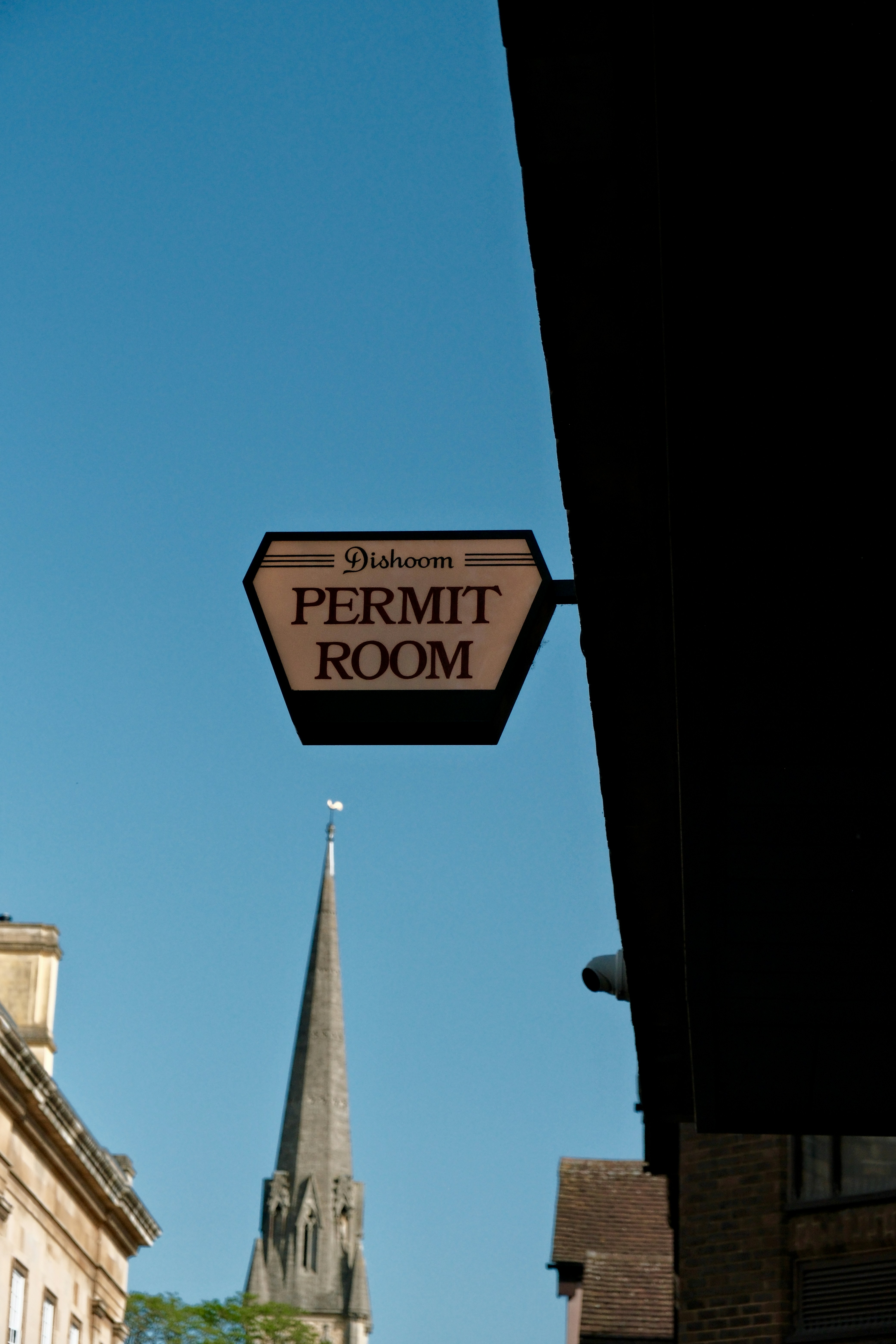 Permit Sign Over a European Street: A Slice of Urban Weeknight Signage