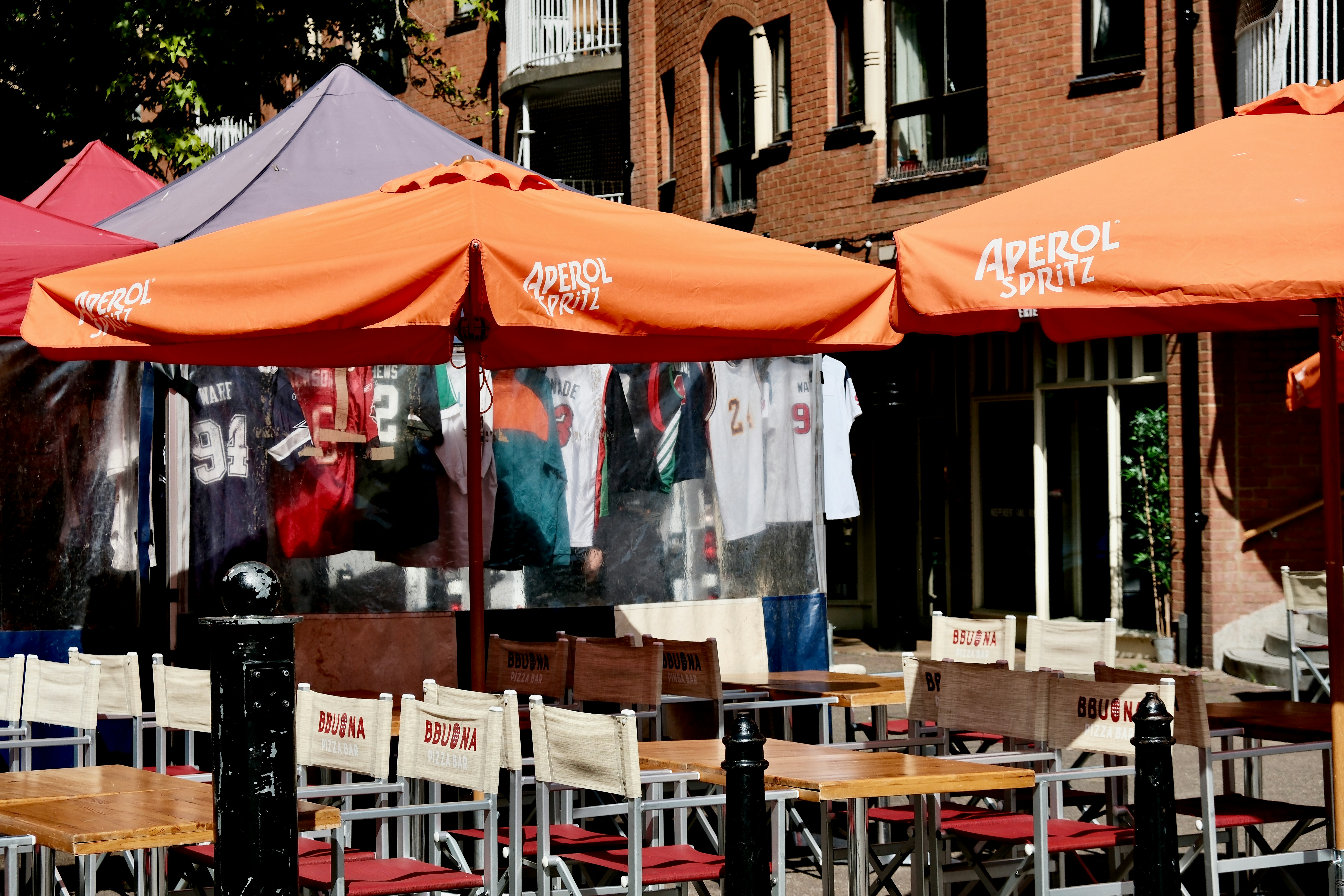 Sunlit Bistro Under Orange Canopies