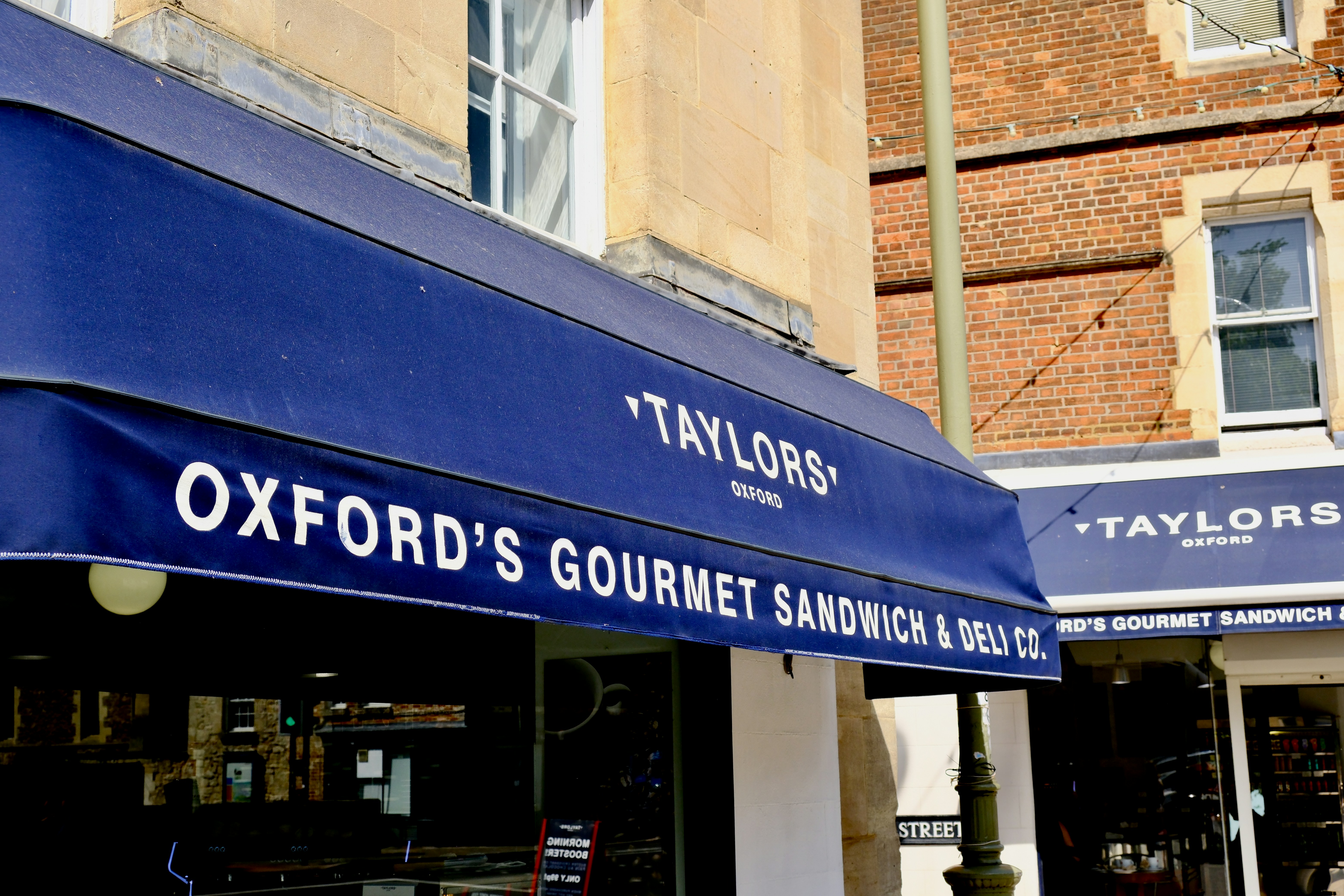 Oxford Gourmet Café Under a Bold Blue Canopy