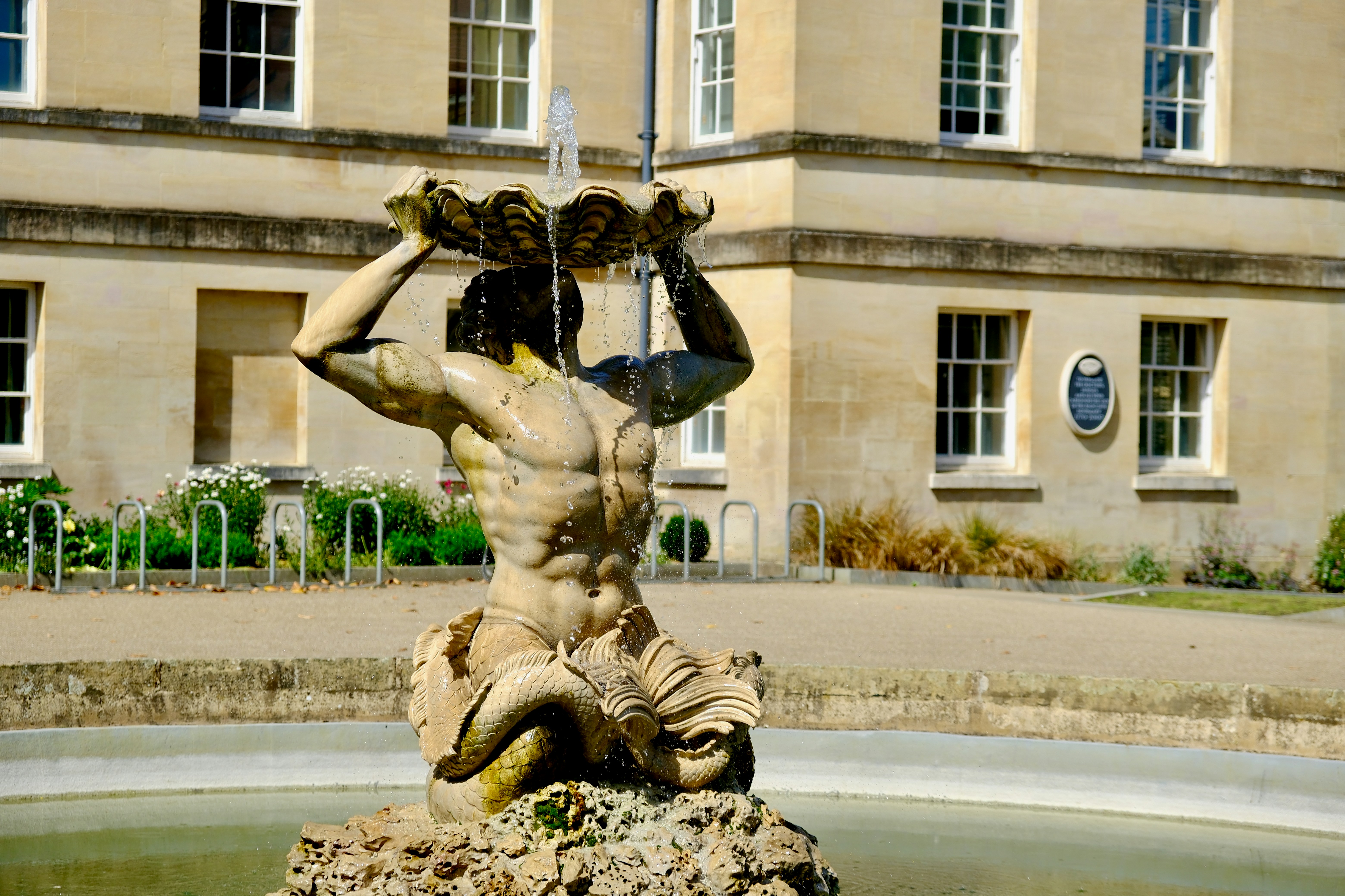 Fountain Warrior: a muscular statue crowned by cascading water
