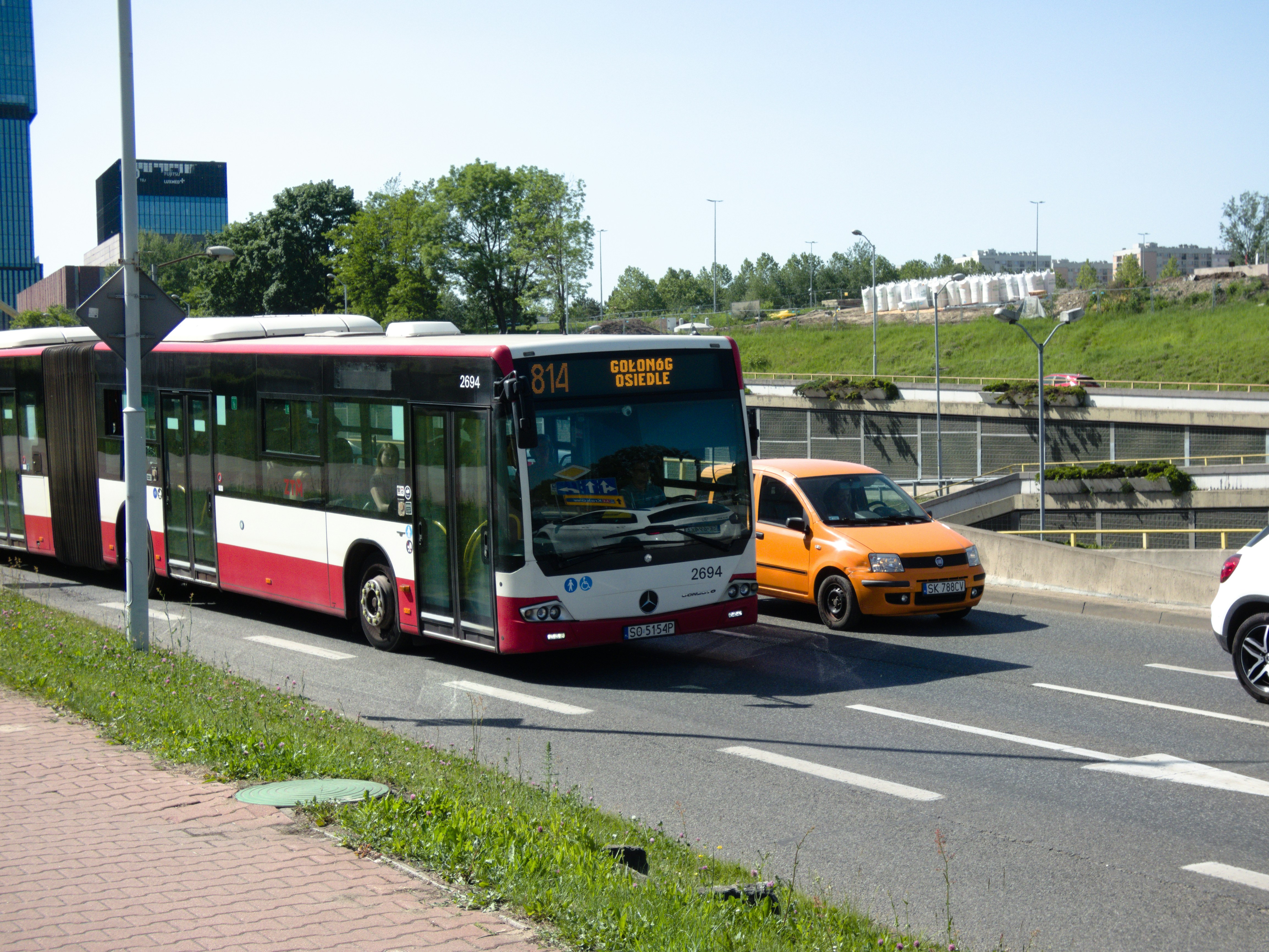 Bus and Car Clash at a Busy Urban Road